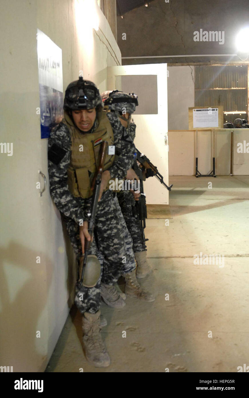 Iraqi policemen assigned to 3rd Federal Police Division, stack on a ...