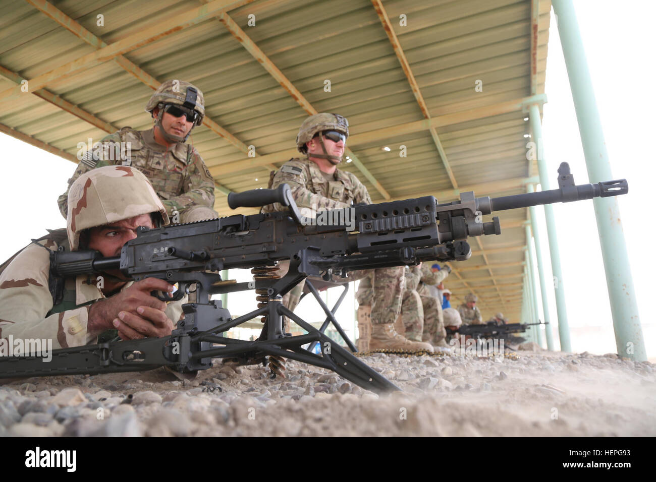 An Iraqi soldier assigned to the 73rd Brigade, 16th Division, fires an ...