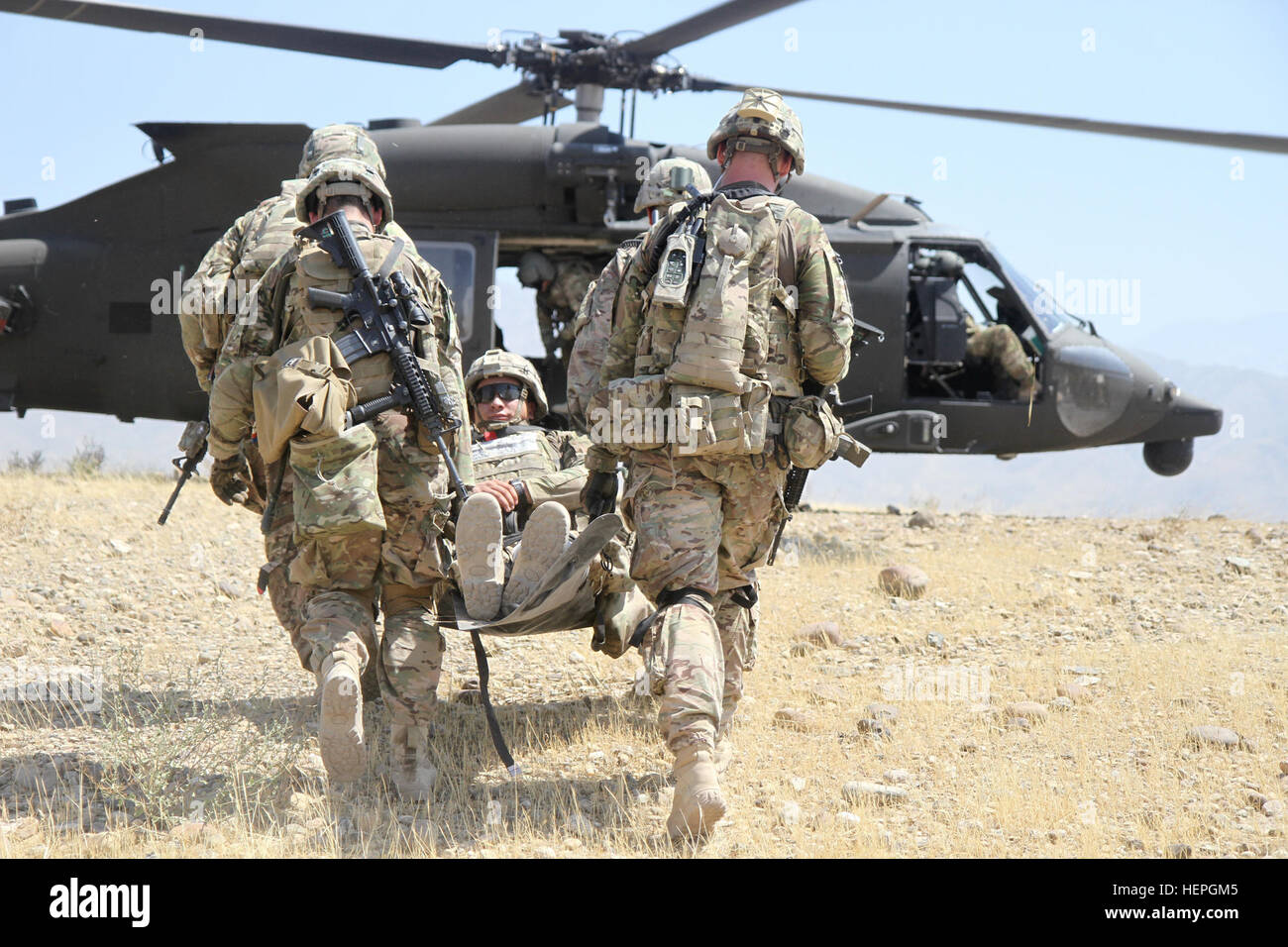 Third Brigade Combat Team, 101st Airborne Division soldiers carry a ...