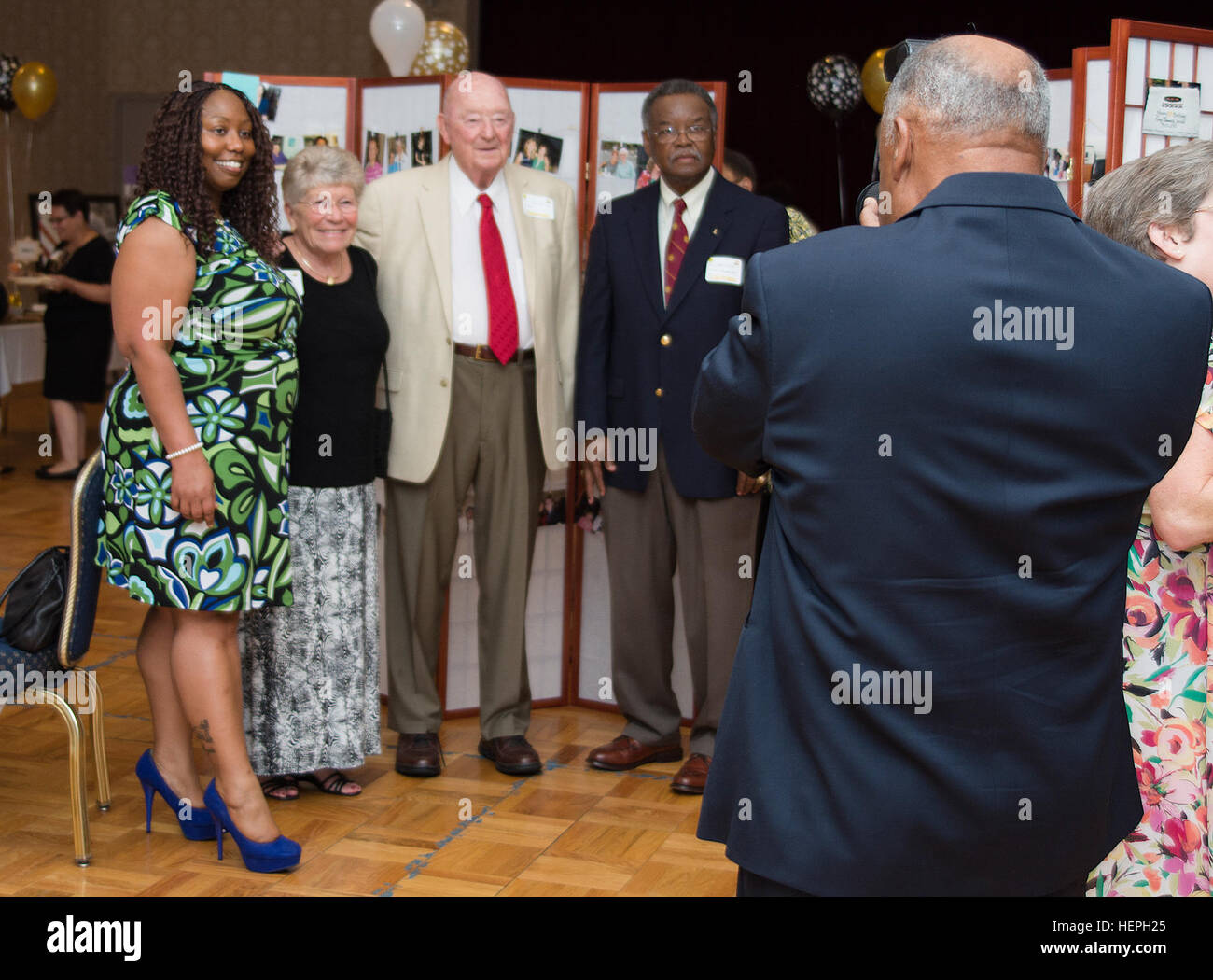 Current and former Army Community Service employees pose for a photo ...