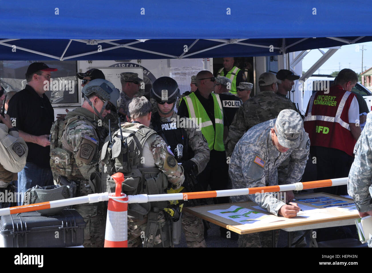 Law enforcement officers from various federal agencies share ...