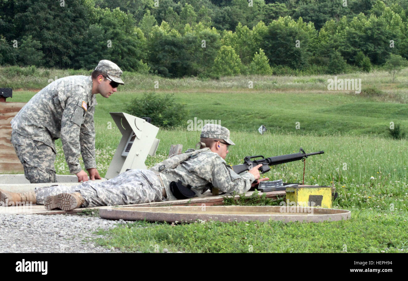 Pfc. Tony Murre of the 104th Training Division (LT), ensures a cadet of ...