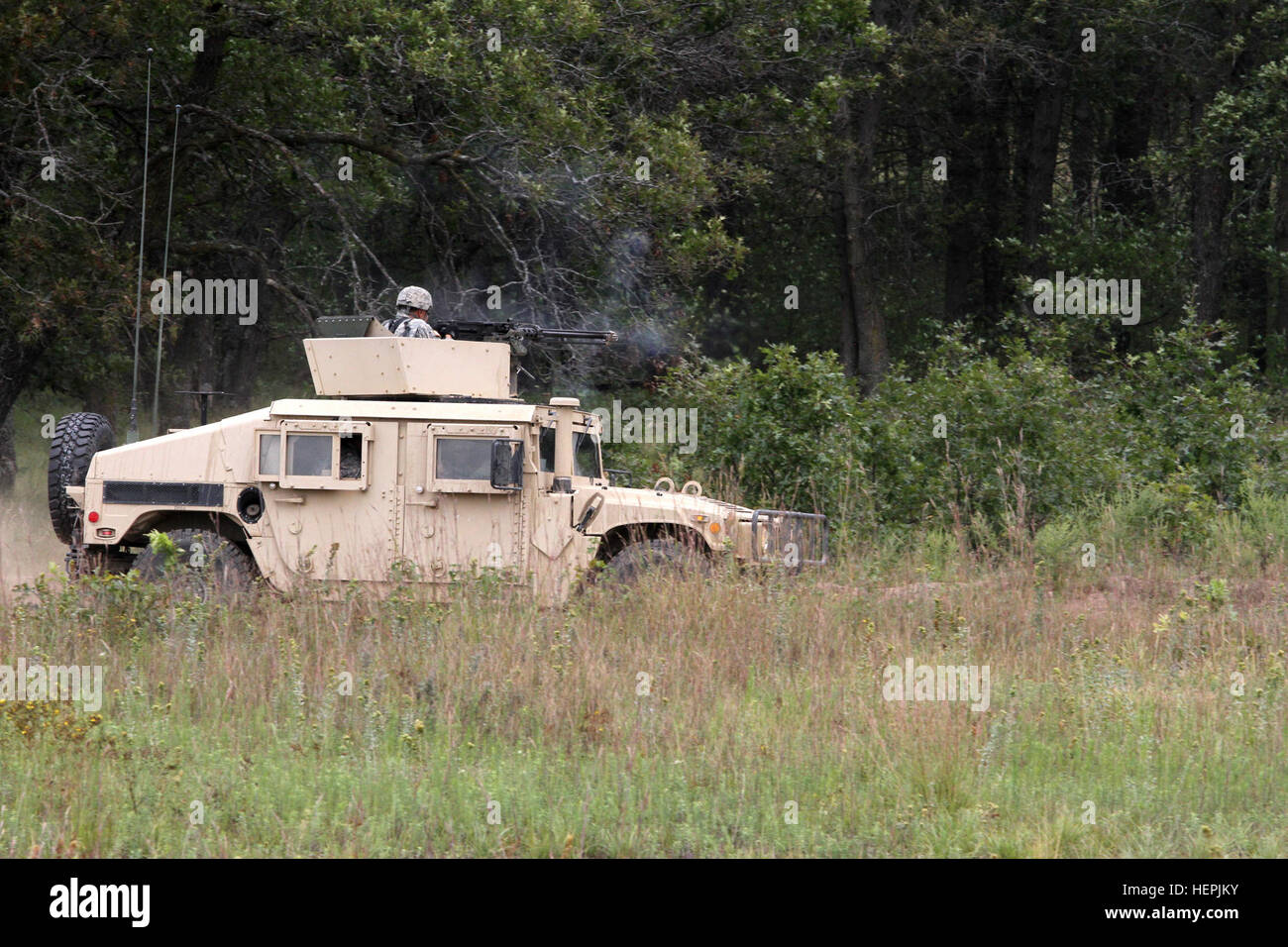 A Humvee gunner from the 32nd Military Police Company, 157th Maneuver ...