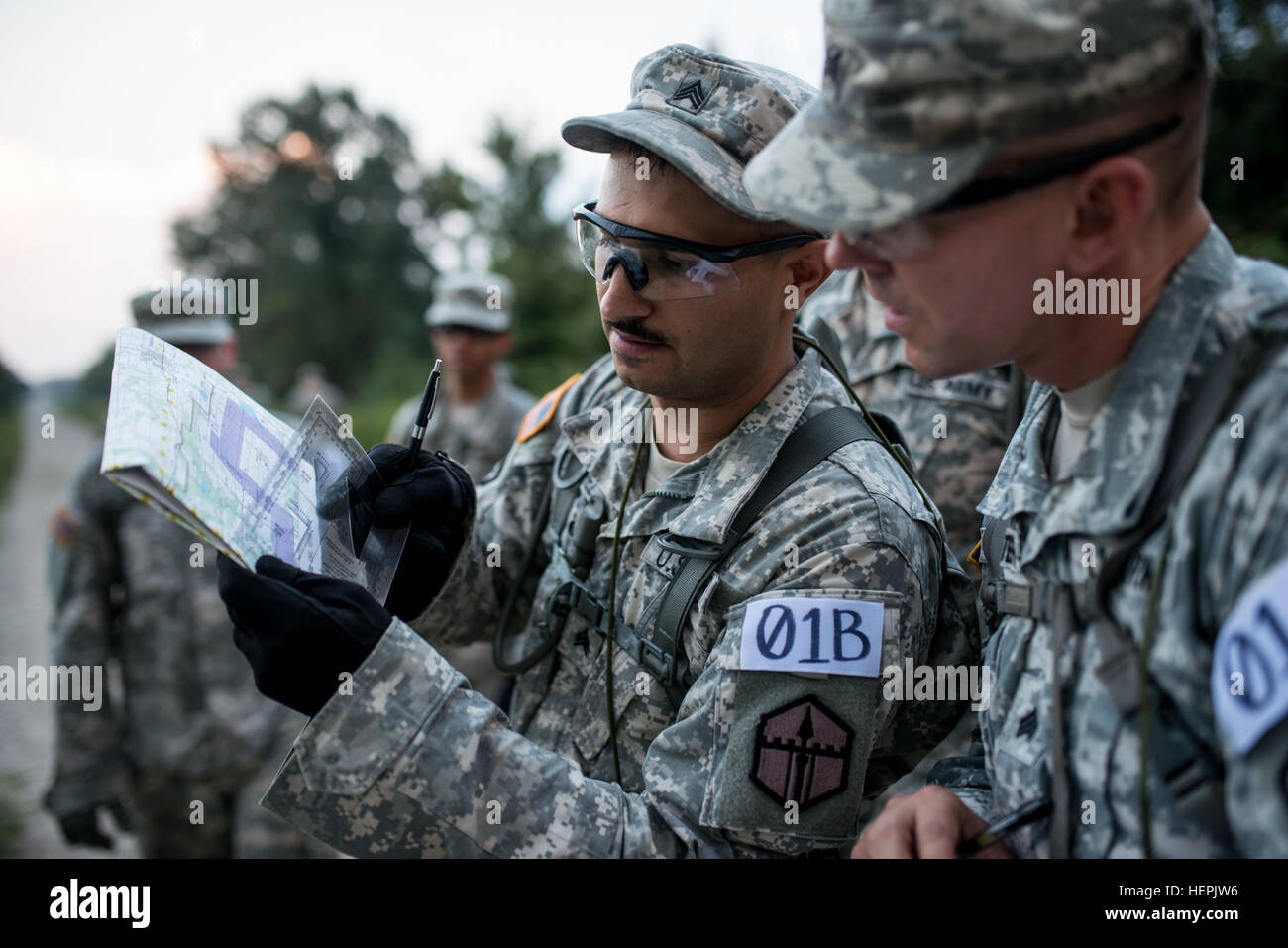 Sgt. Christian R. Sanchez reviews grid coordinates with Sgt. Brett ...
