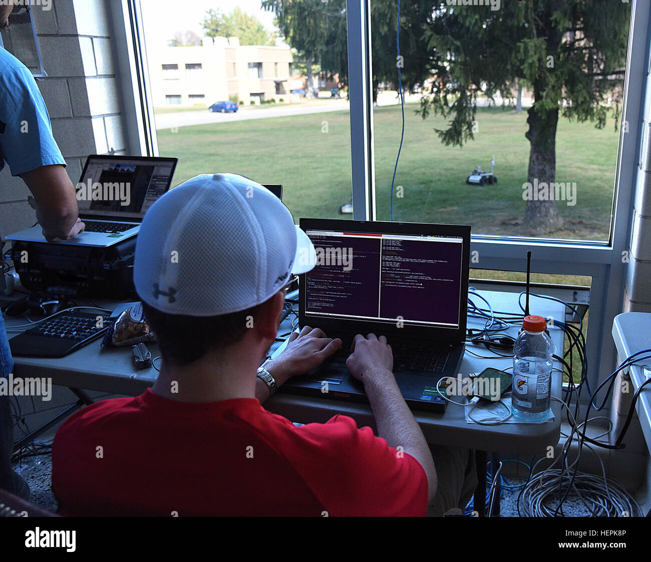 Jason Gregory, a computer engineer with the Army Research Lab, inputs ...