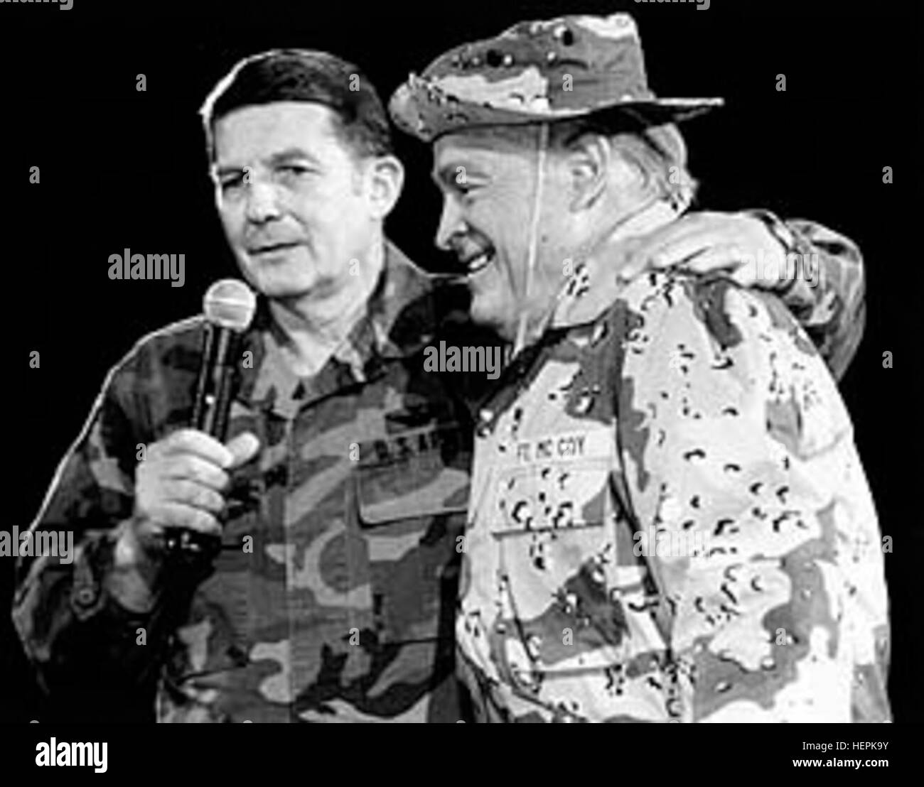 Fort McCoy Garrison Commander Col. Raymond G. Boland shares an on-stage ...