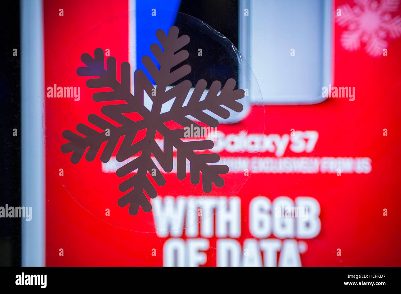 A high Street shop window, decorated for christmas with display of ...