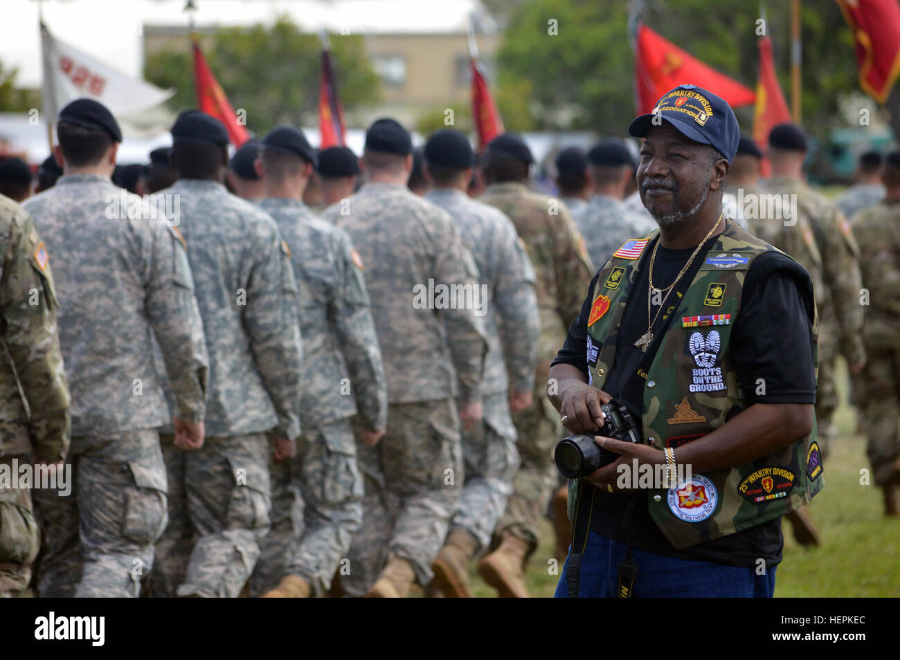 A Vietnam veteran watches the 25th Infantry Division pass and review at ...