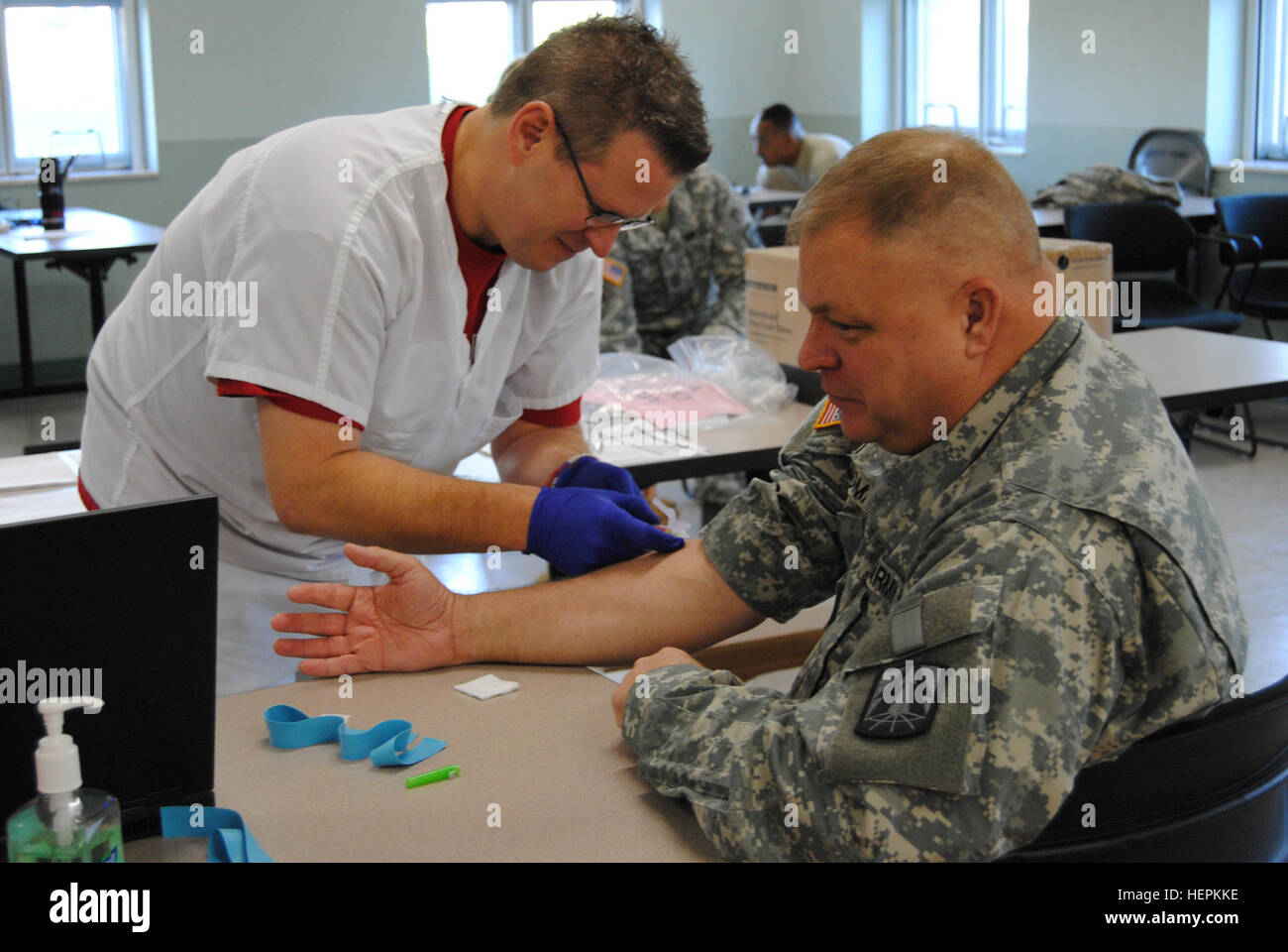 A soldier from Detachment 10, 335th Signal Command, receives a ...