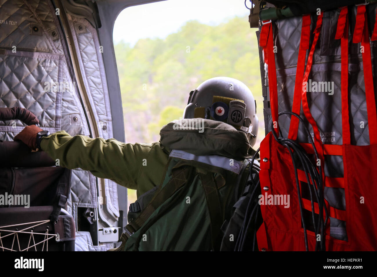 A Canadian crew chief on a CH-147F Chinook assigned with the 450th ...