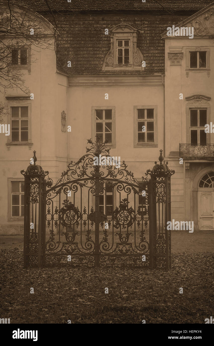 Single wrought-iron gate in front of an old baroque manor house in Mecklenburg-Pomerania ...