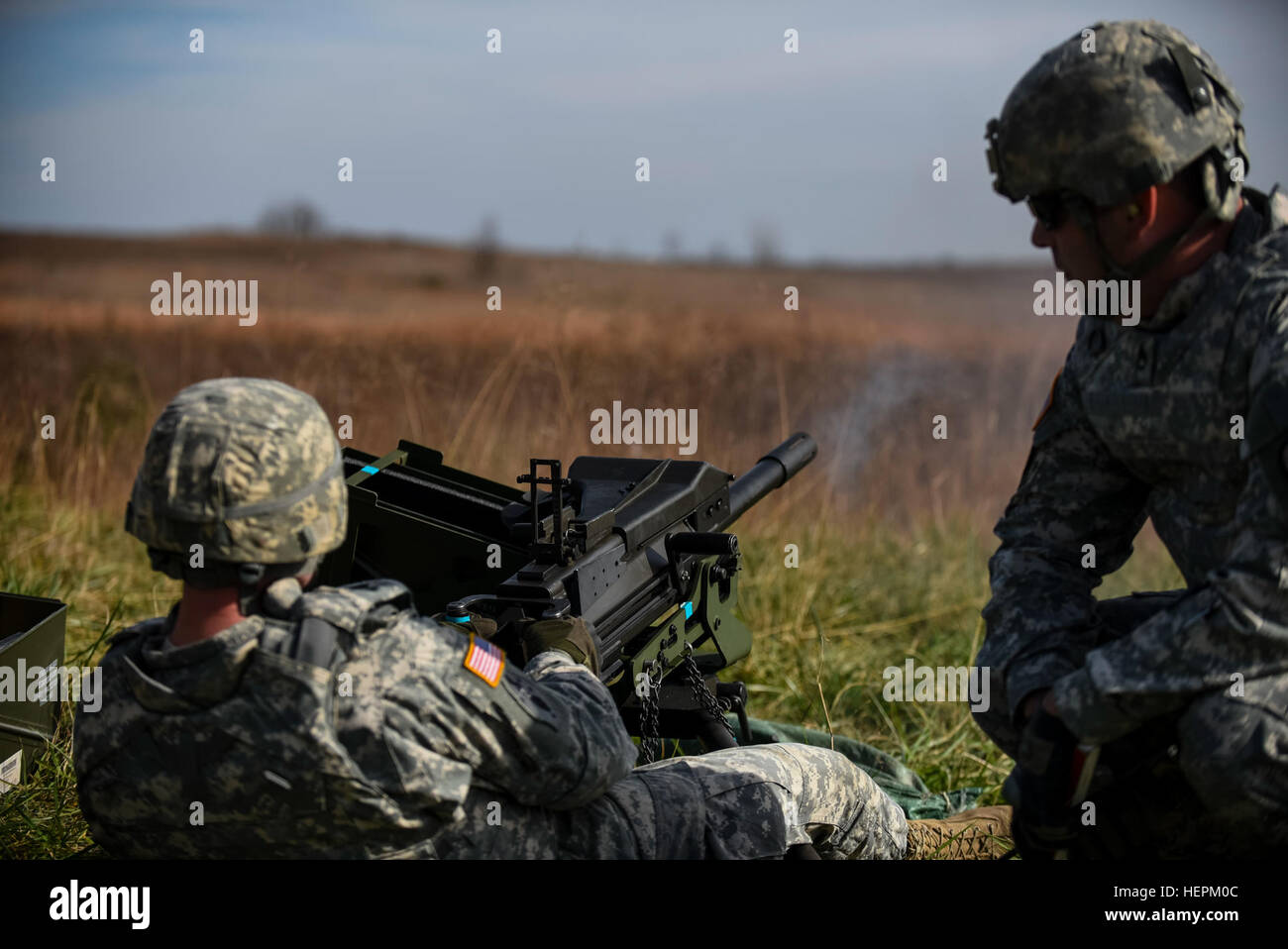 A U.S. Army Reserve military police Soldier fires a MK19 machine ...