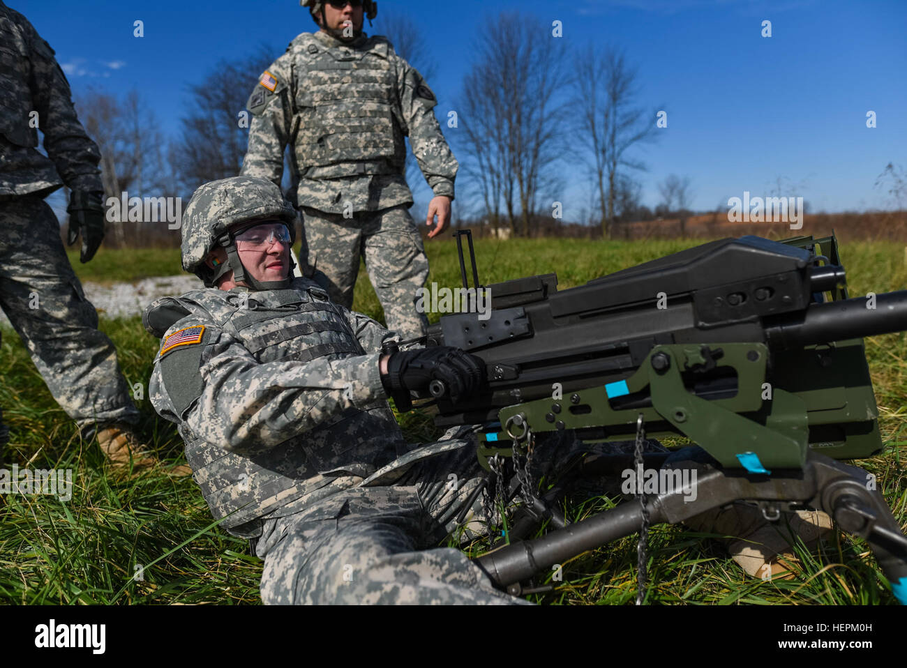 A U.S. Army Reserve military police Soldier pulls the charging handles ...