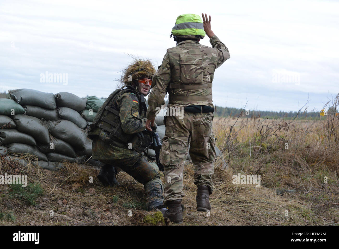 A German soldier (left), assigned to the Hammelburg Infantry Training ...