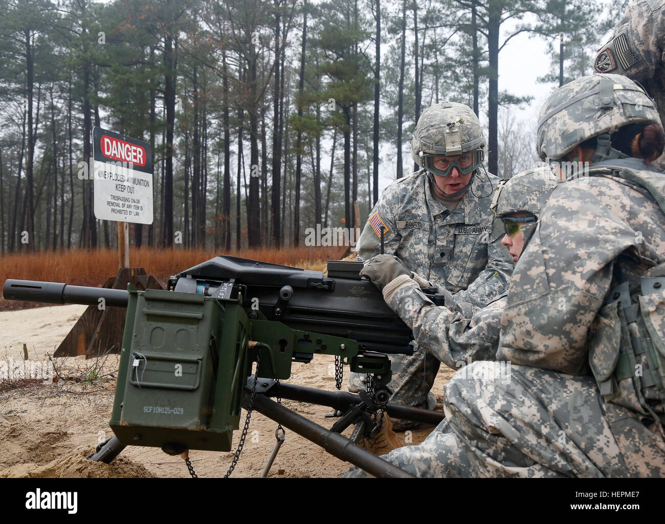 U.S. Soldiers, assigned to 55th Signal Company (Combat Camera), adjust ...
