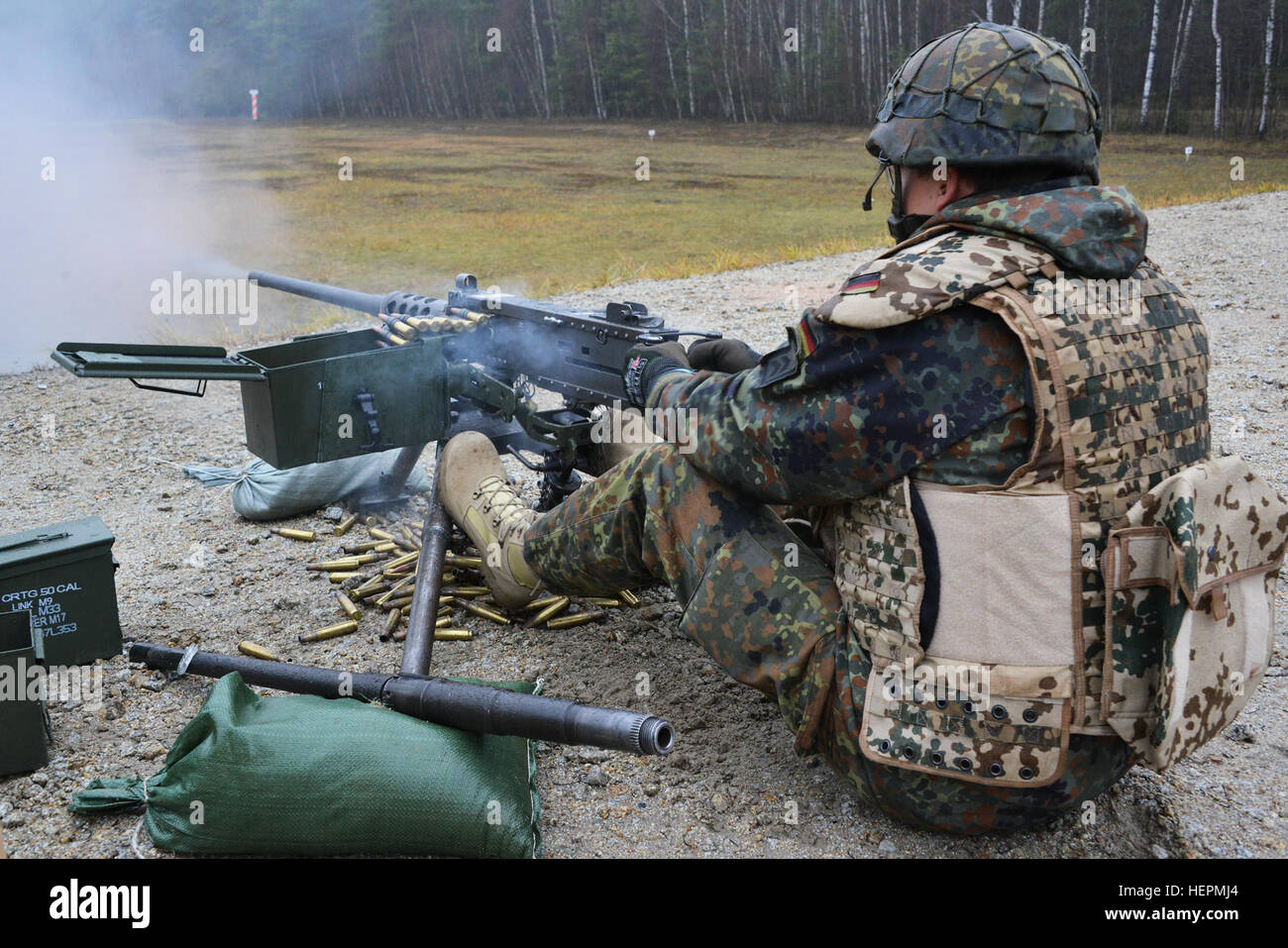 A German soldier fires a .50-caliber machine gun during a ...