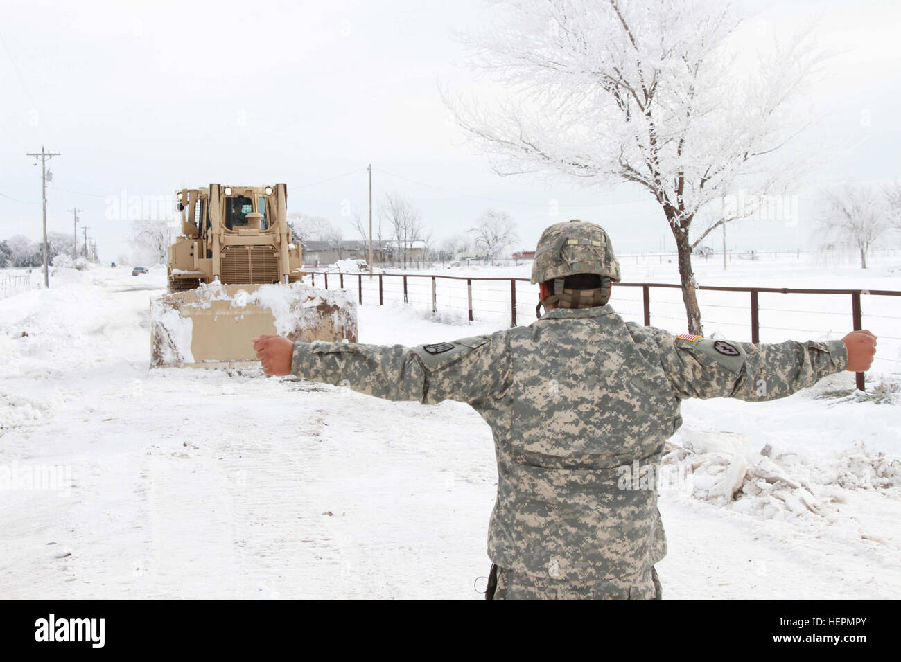 Sgt. Jesus Anaya guides a D70 Bulldozer driven by Sgt. Clarence ...