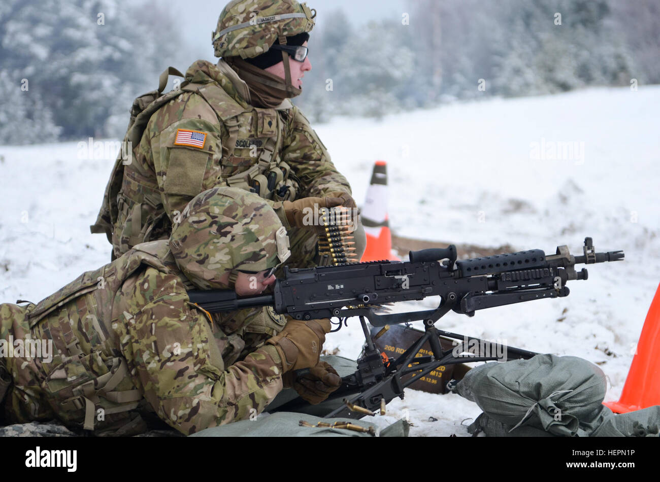 Pvt. Gage Adams, a scout and native from Springboro, Pa., fires an M240 ...