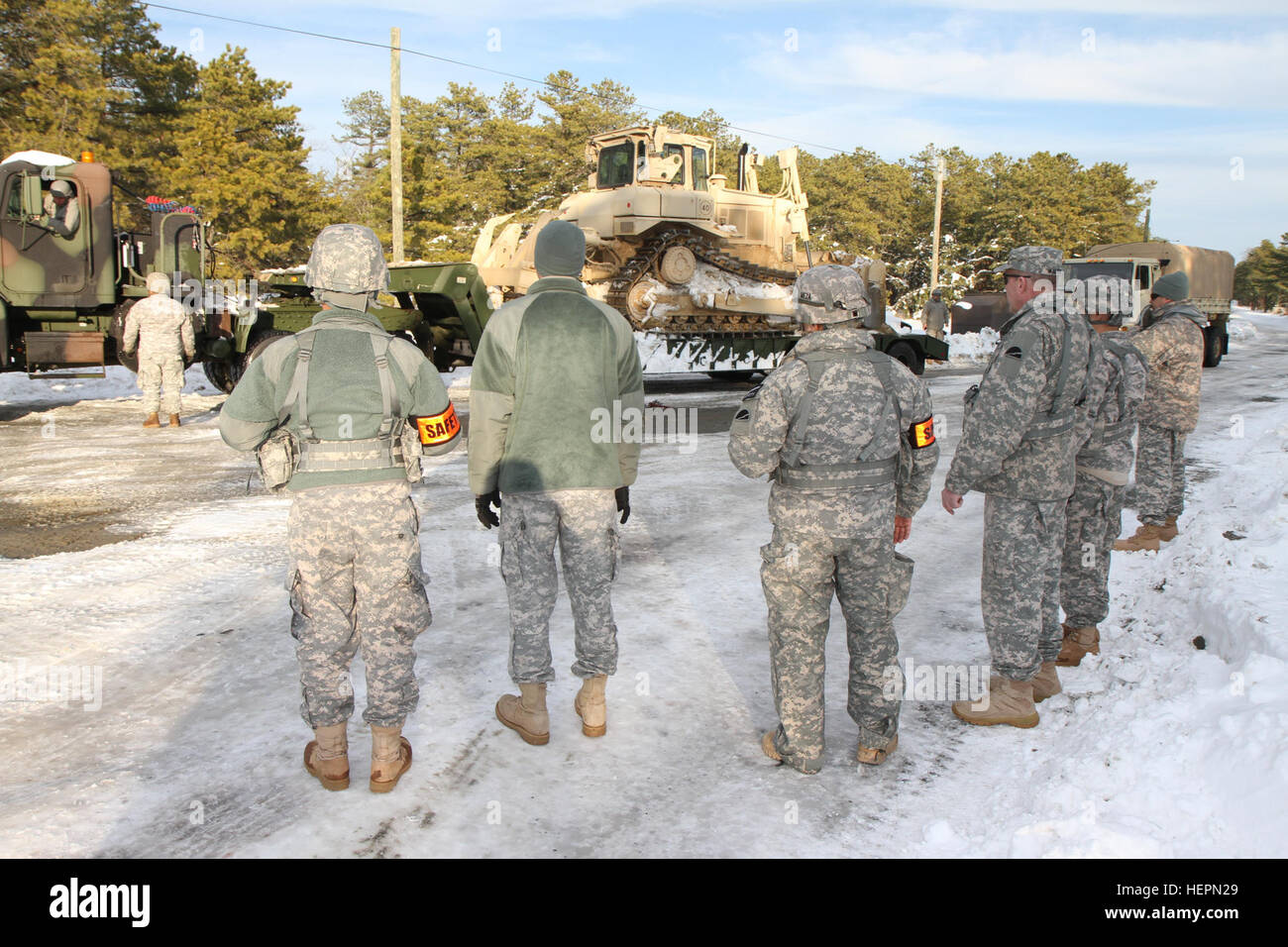 U.S. Army Soldiers of the 78th Training Division observe the offloading ...