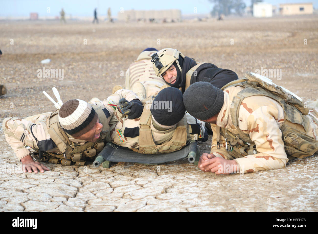 Iraqi soldiers enrolled in the Junior Leaders Course, protect a ...