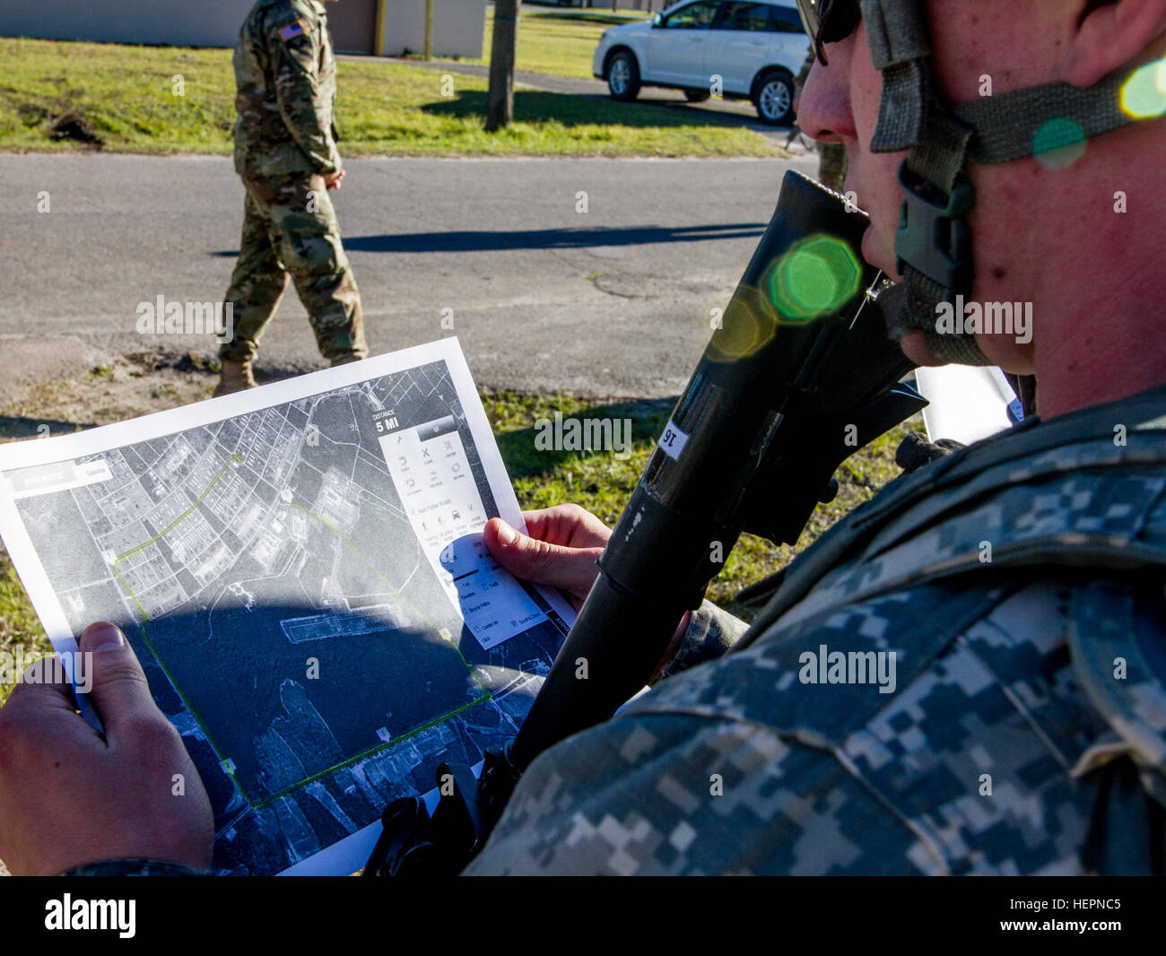 A U.S. Army Reserve Soldier examines a course map Feb. 10 before a ruck ...