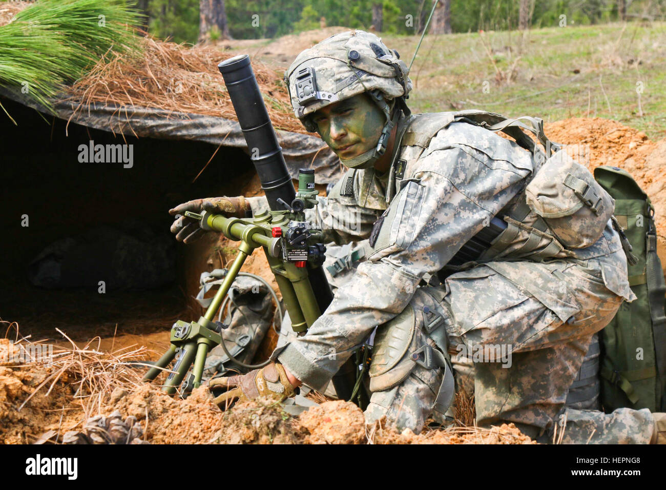 U.S. Army Parachute Infantry soldiers set up and adjust 60mm mortars ...