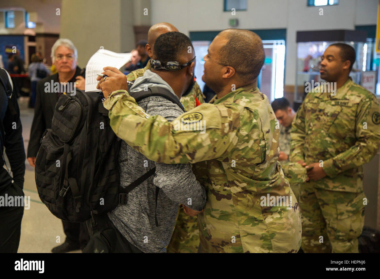 U.S Army Maj. Rodney Lamberson, an Army Trials action officer, greets ...