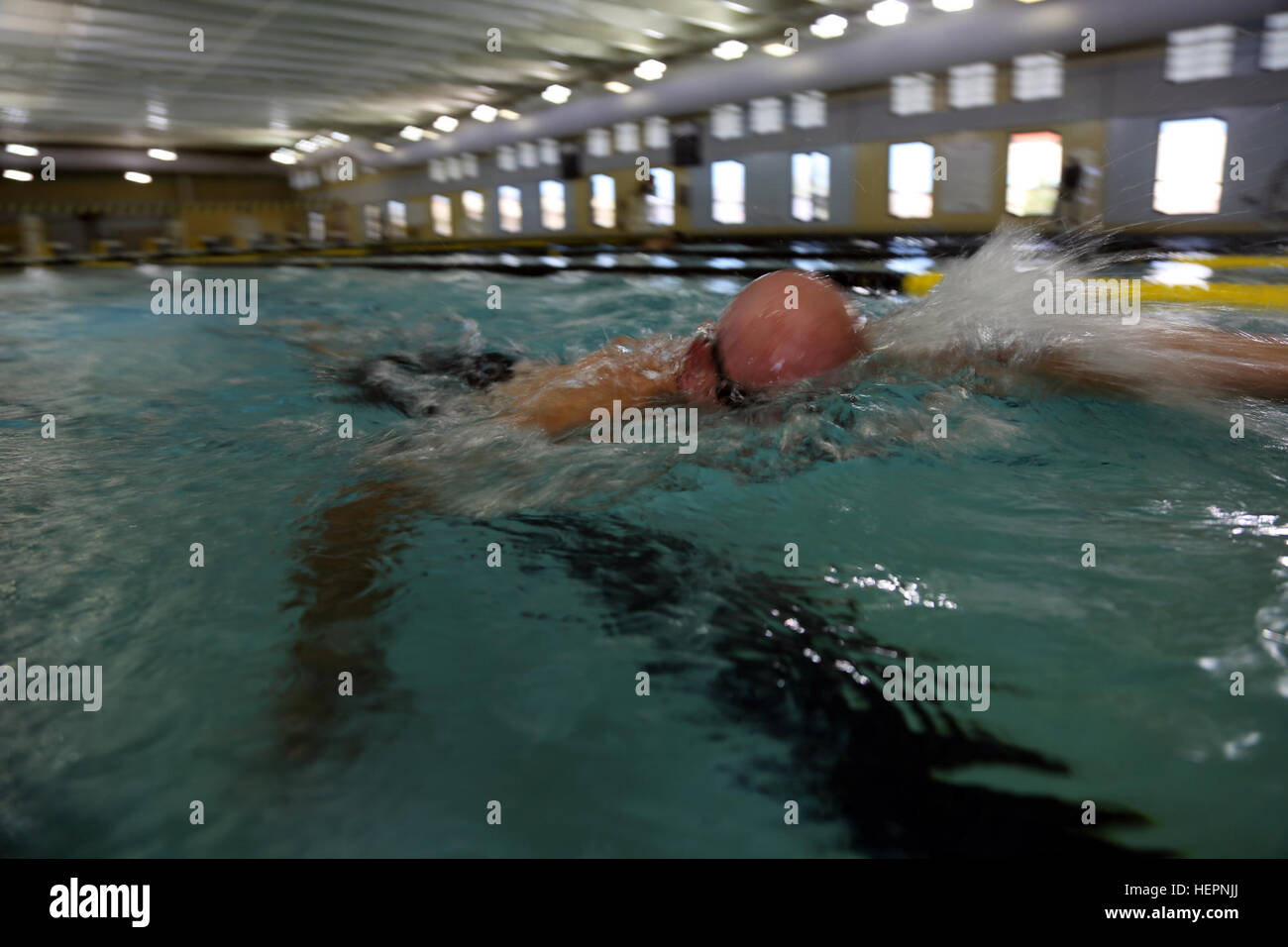 An Army athlete practices his swimming techniques at the Aquatics ...