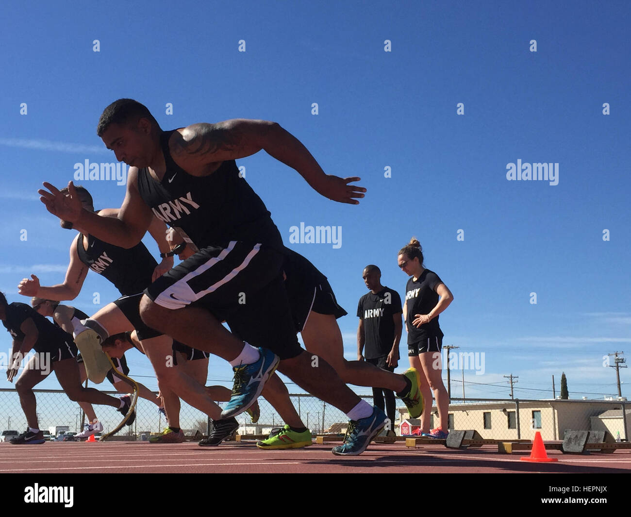 U.S. Army Sgt. 1st Class Julio Rodriguez practices block start drills ...