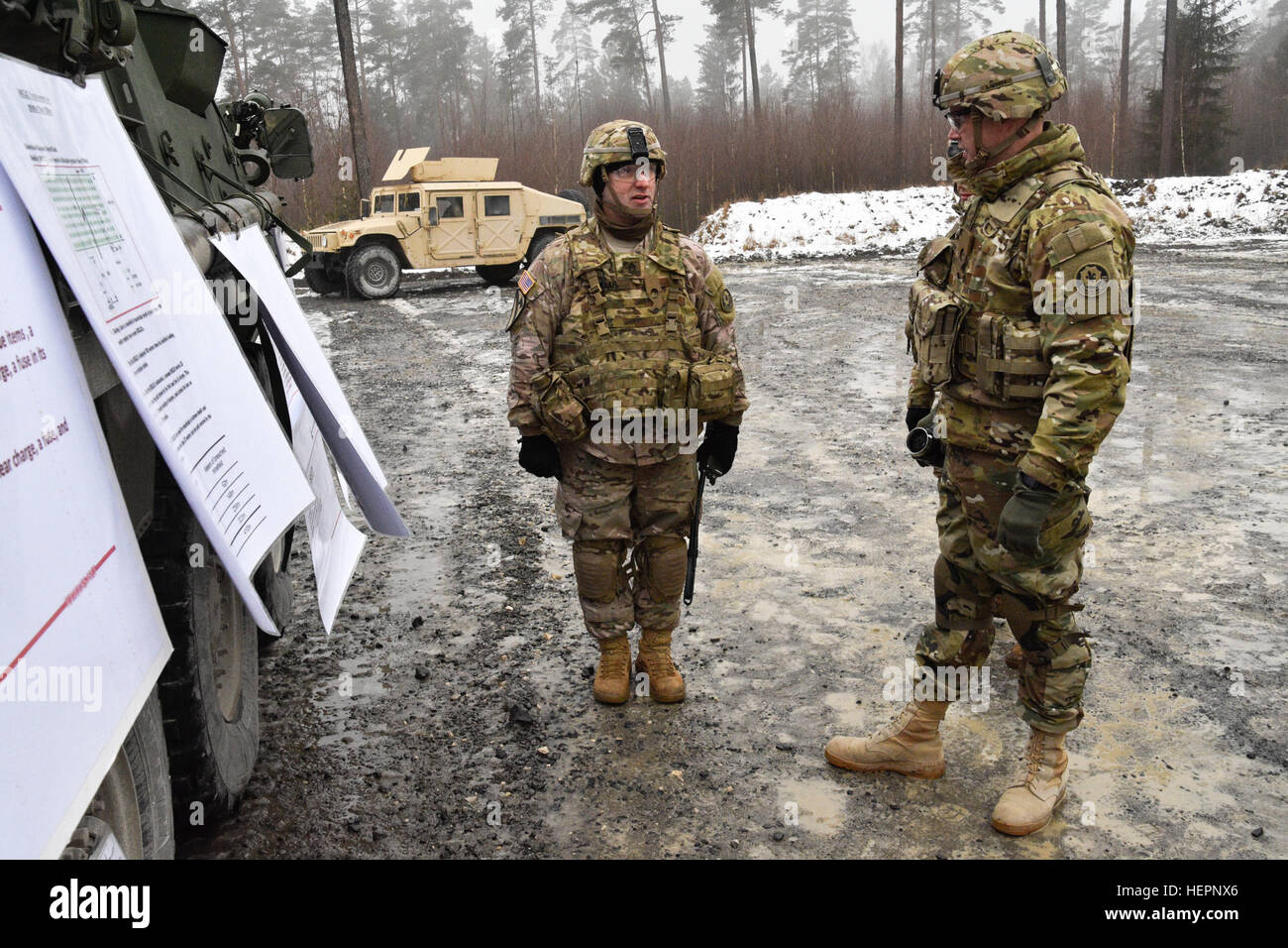 Staff Sgt. Thomas Raab (middle), a combat engineer assigned to Alpha ...
