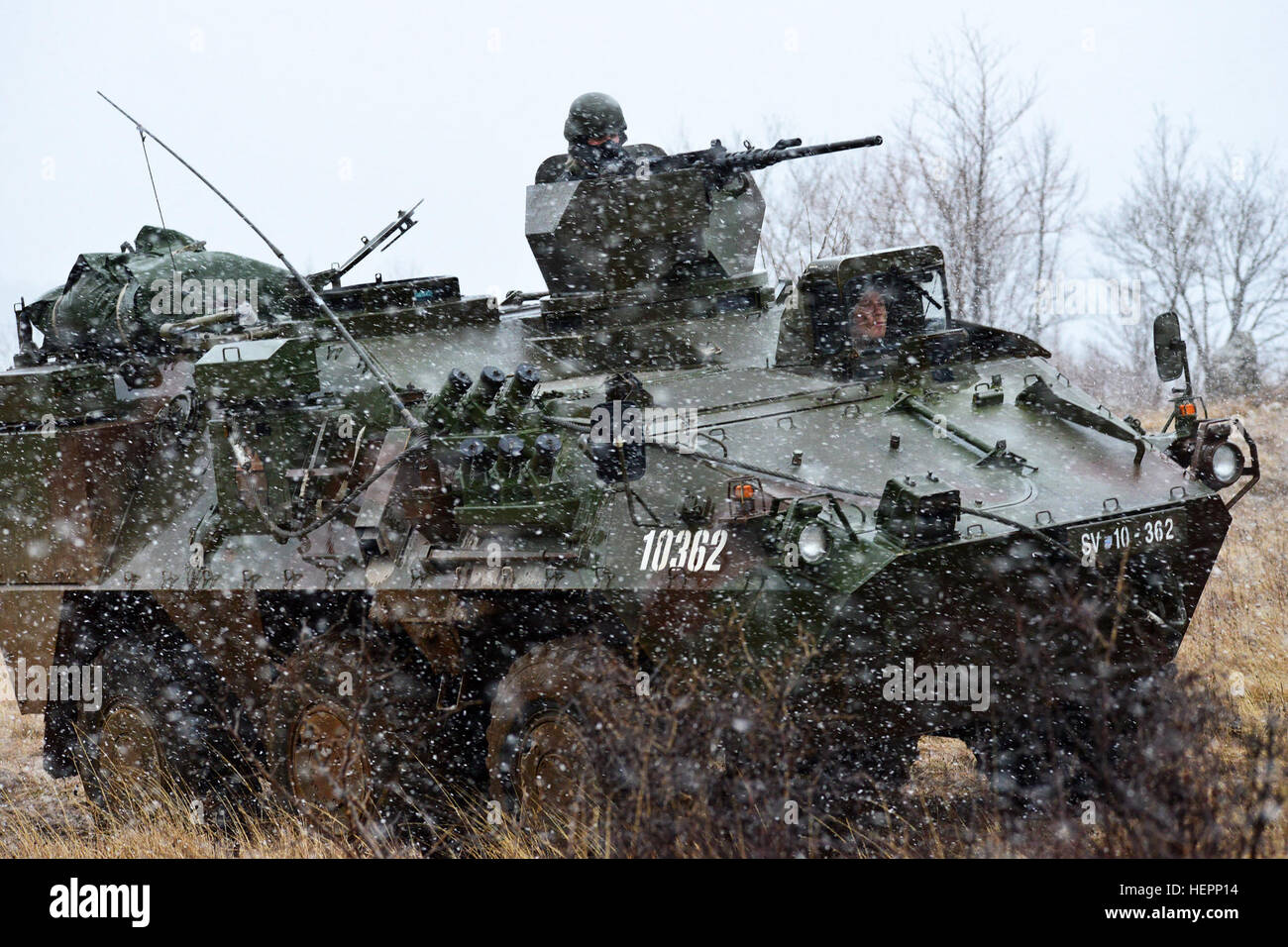 A Slovenian Valuk, a light wheeled armored vehicle, moves an objective ...