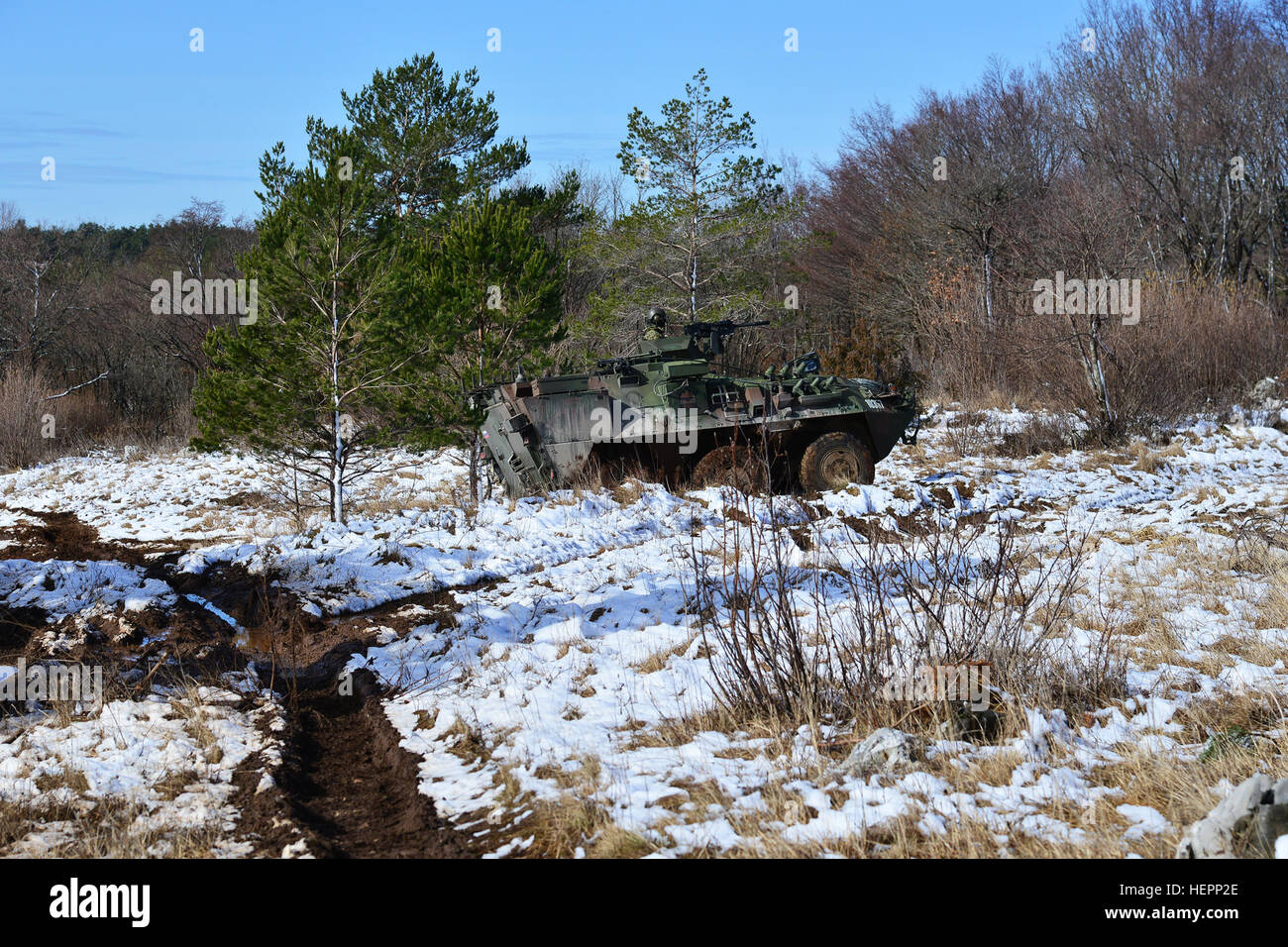A Slovenian Valuk, a light wheeled armored vehicle, provides security ...