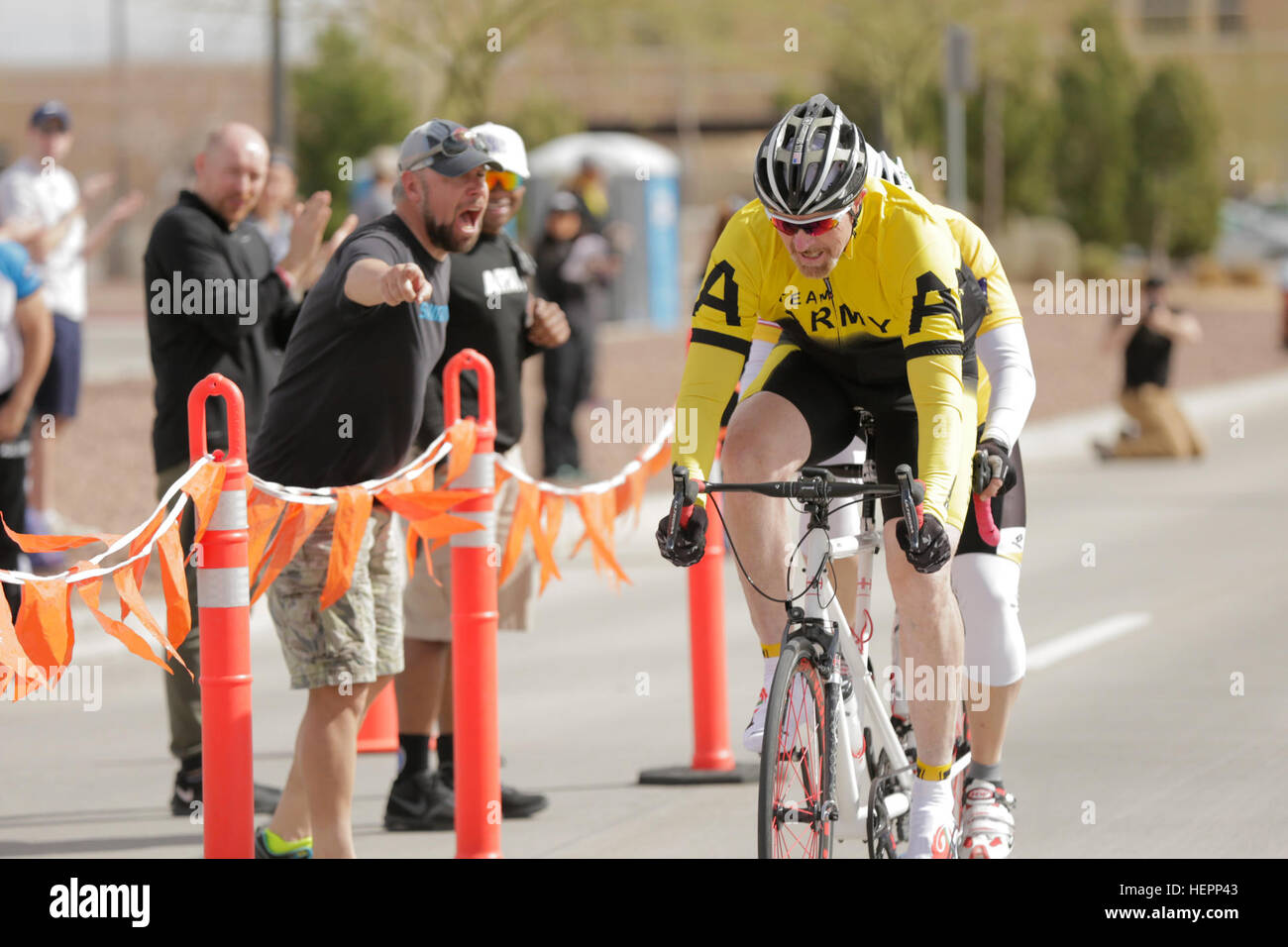 U.S. Army athletes pedal to finish line during the timed trials for the ...