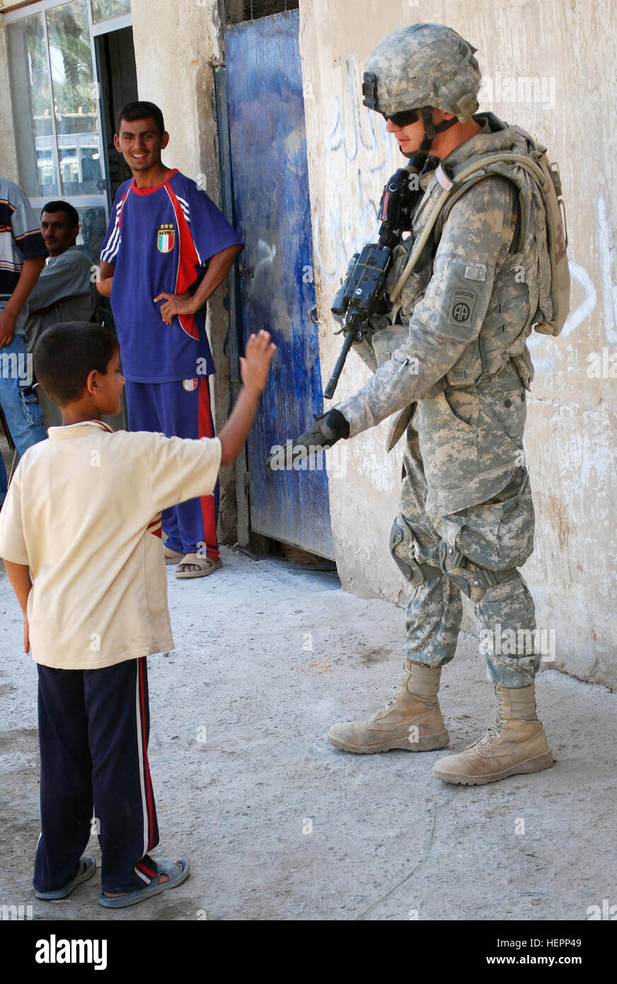 Staff Sgt. Timothy Bridge, of San Antonio, Texas, receives a "low-five ...