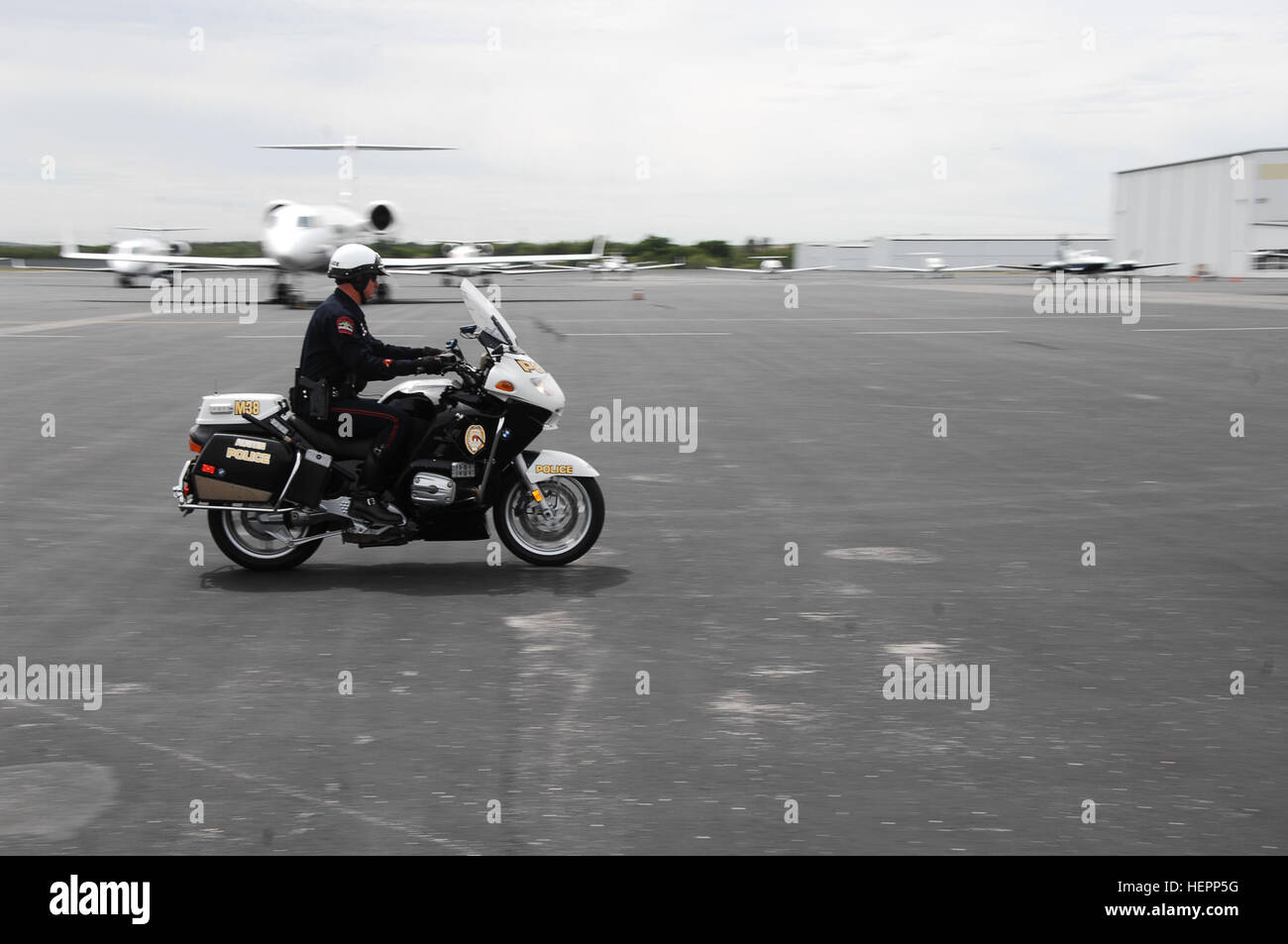 Police officers align their motorcycles in the flight line of Bergstrom ...
