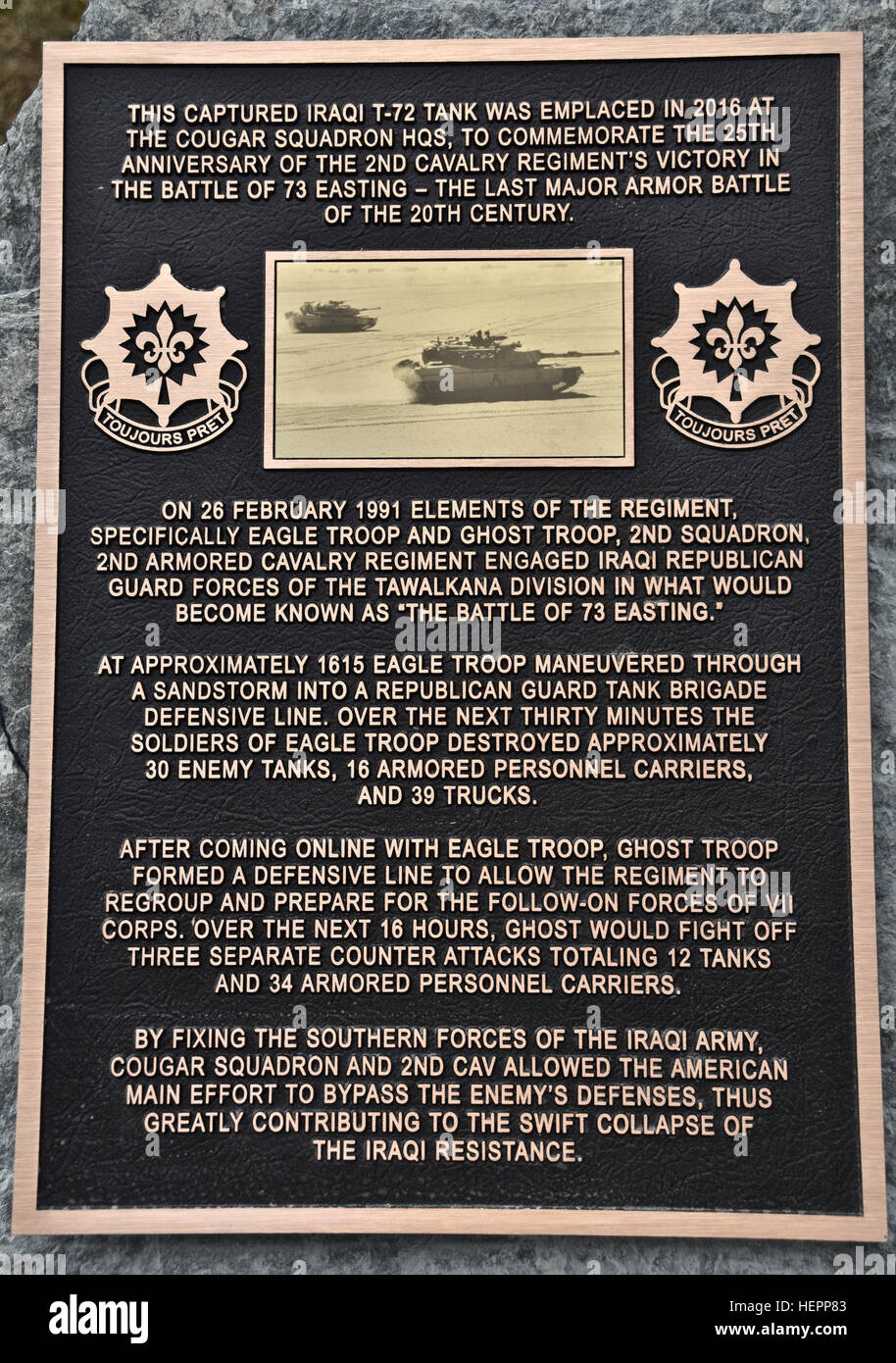 A bronze plaque, explaining the history of the Battle of 73 Easting, is ...