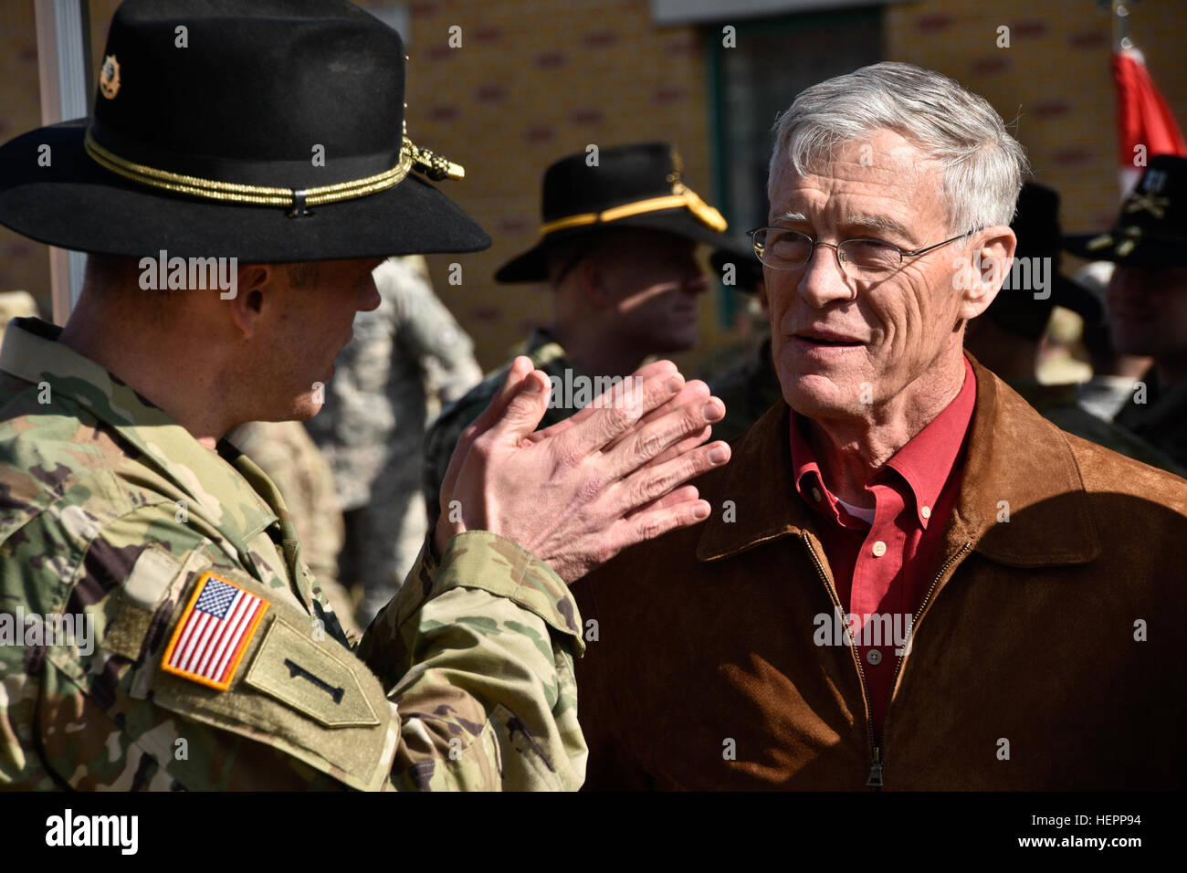 Col. John V. Meyer III (left,) the 78th colonel of the Regiment speaks ...