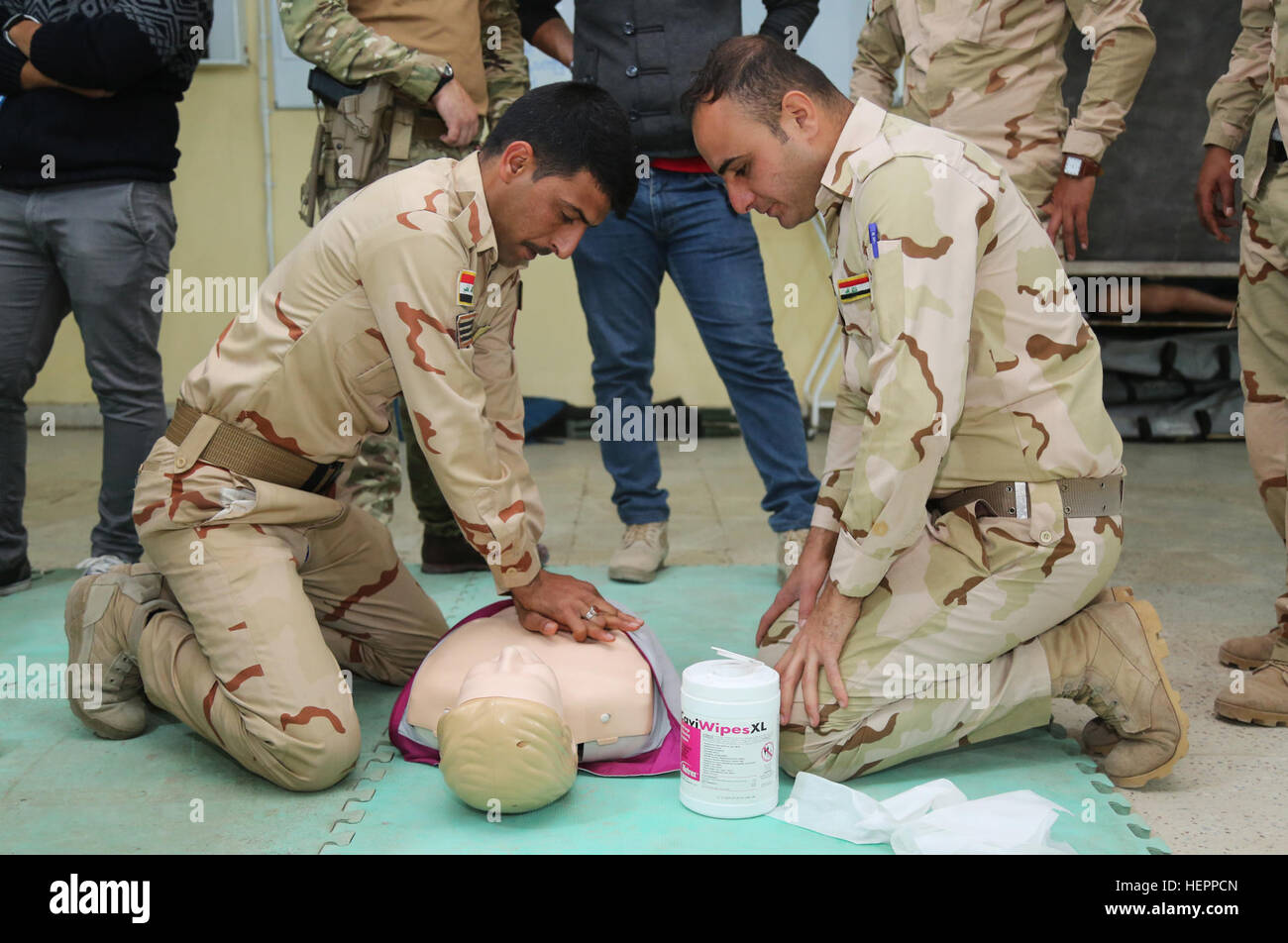 Iraqi soldiers enrolled in the Iraqi Combat Medics Course conduct chest ...