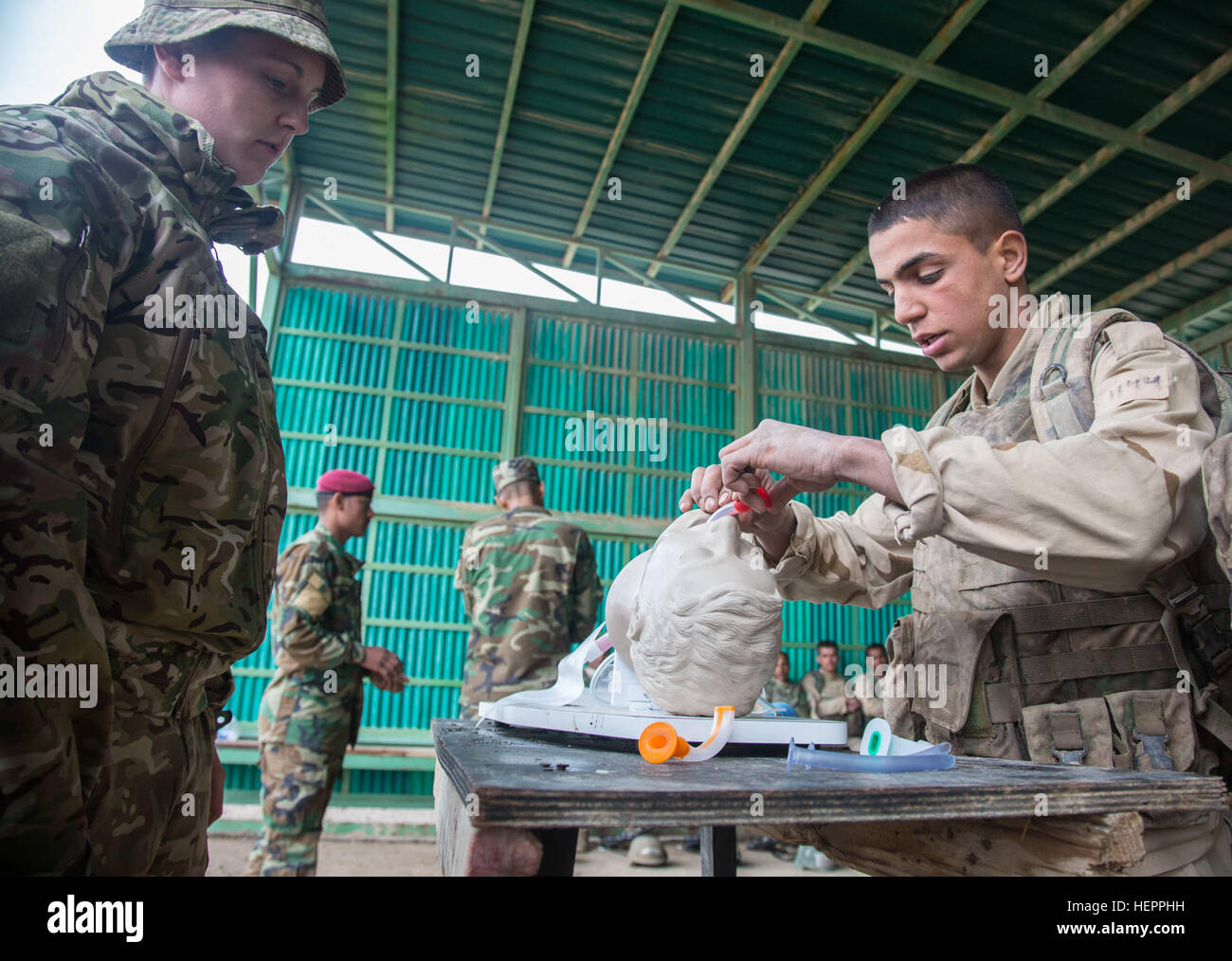 A British soldier, left, with the Royal Army Medical Corps, observes an ...
