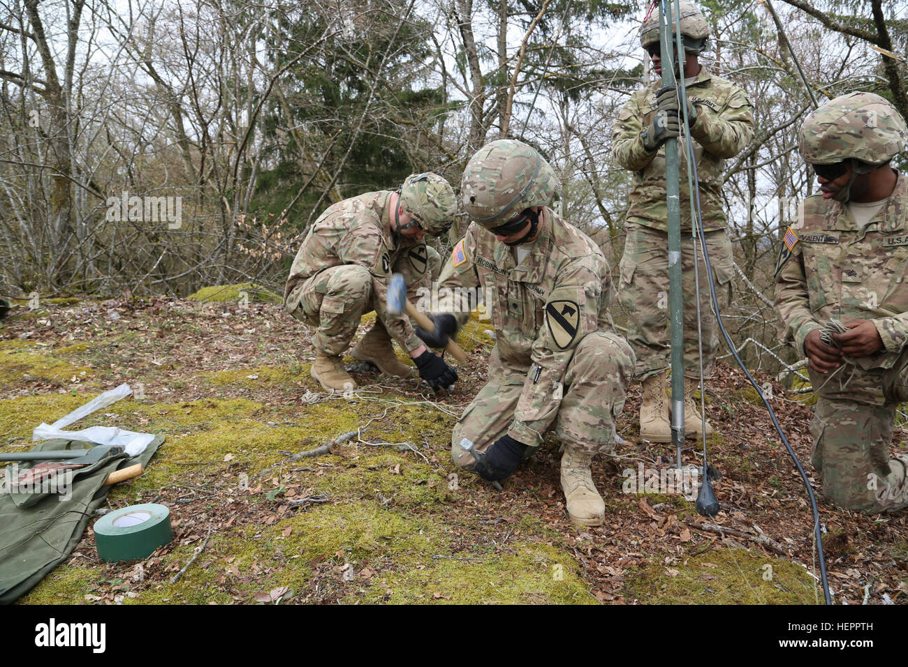 U.S. Army aviation support soldiers erect OE-254 antennas and conduct ...