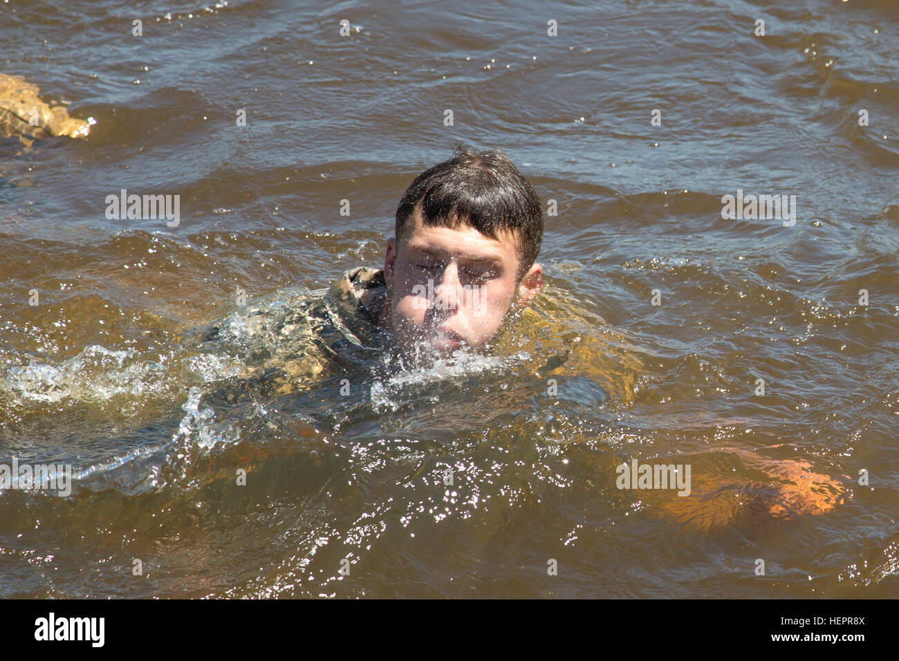 A U.S. Army Ranger swims in Victory Pond during the Best Ranger ...