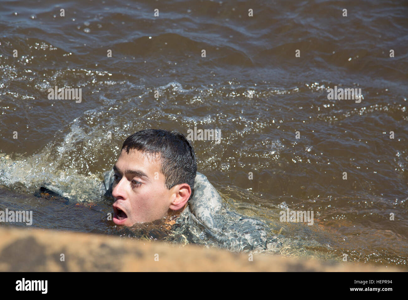 A U.S. Army Ranger swims in Victory Pond during the Best Ranger ...