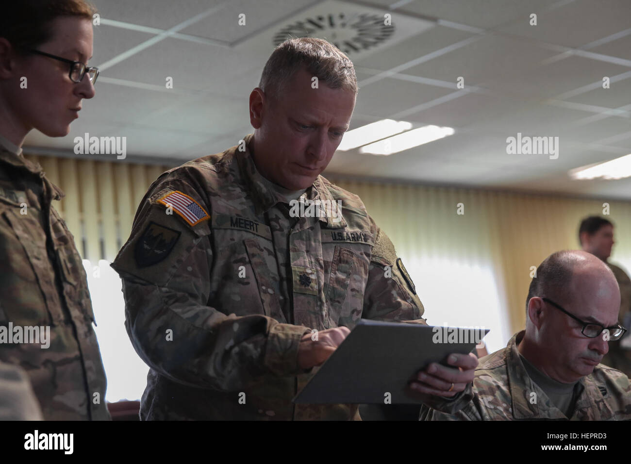 A U. S. Soldier of 18th Combat Service Support Battalion reads a ...