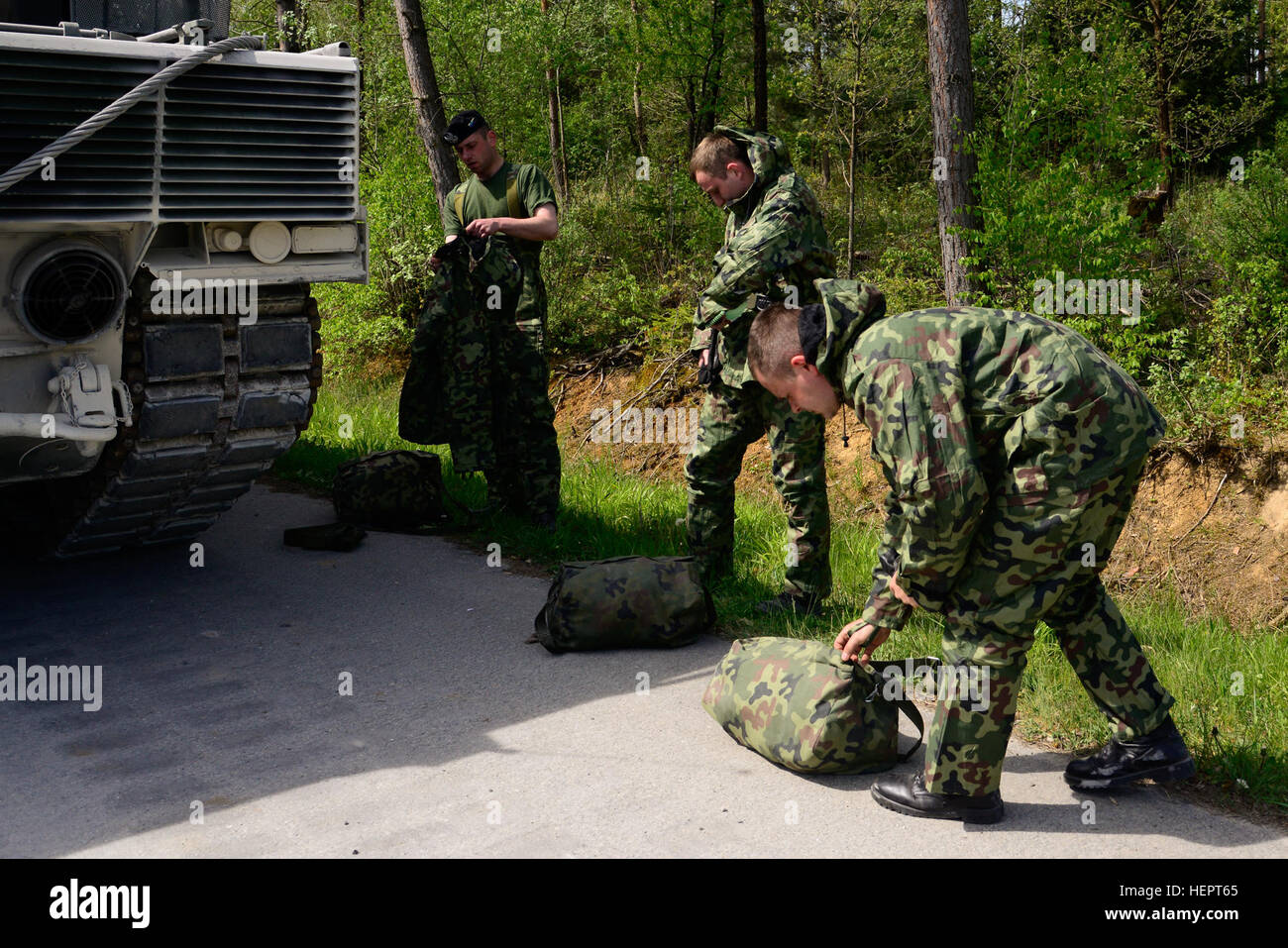 Polish soldiers, assigned to the 34th Armor Cavalry Brigade, don their ...