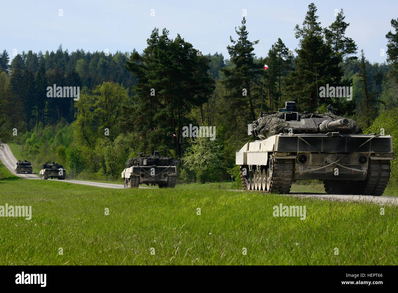 Polish soldiers, assigned to the 34th Armor Cavalry Brigade, drive ...