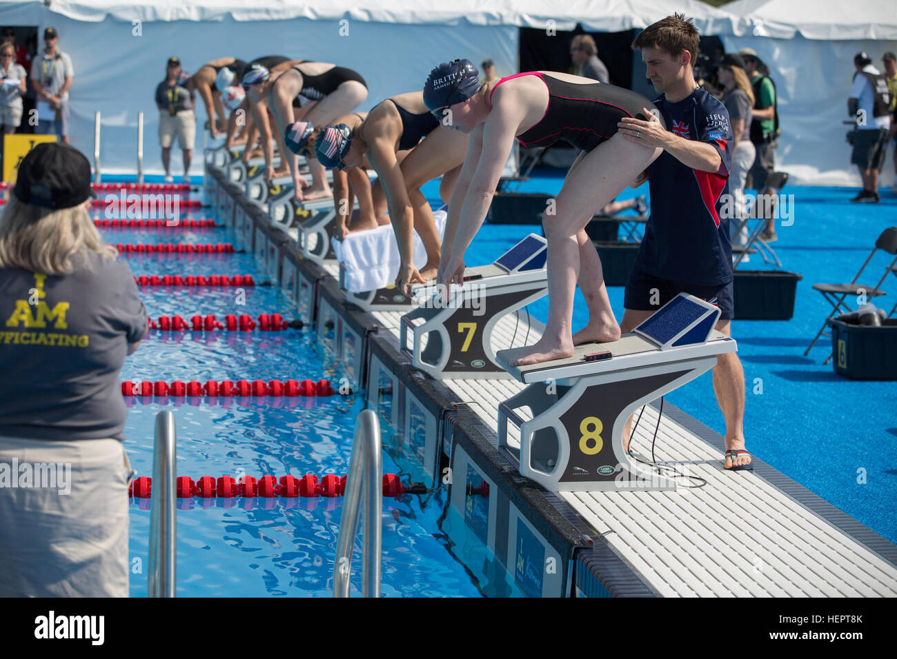 Competitors line up to begin event 17, 50 meter breaststroke, during ...