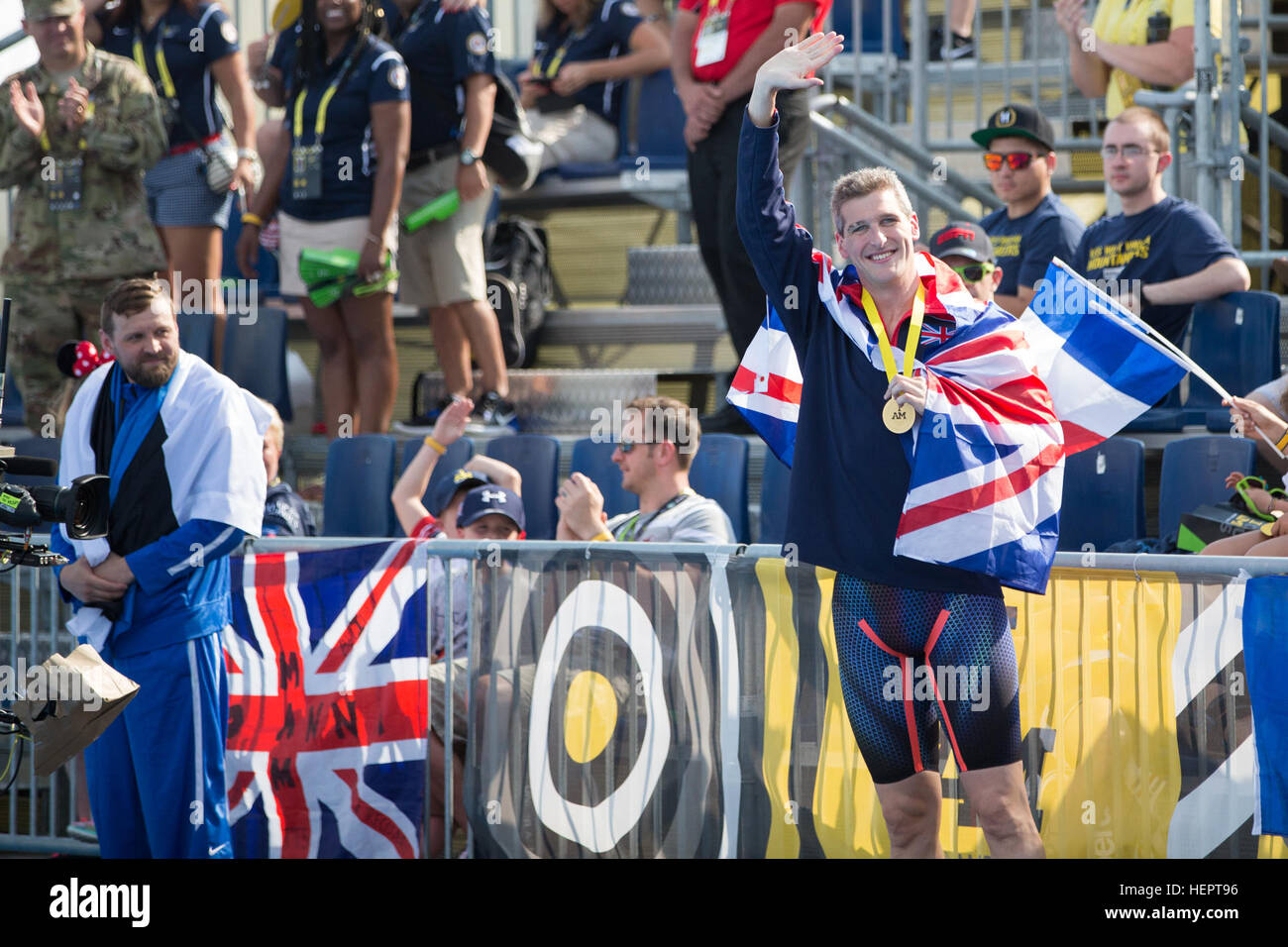 David Wiseman, United Kingdom, waves to the crowd after receiving a ...