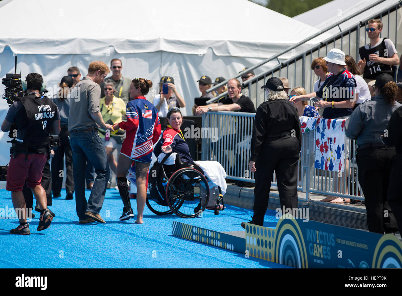 Elizabeth Marks, United States gives Prince Harry her medal after the ...