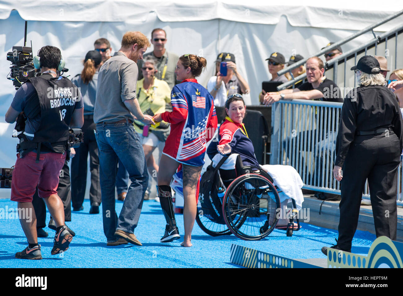 Elizabeth Marks, United States gives Prince Harry her medal after the ...