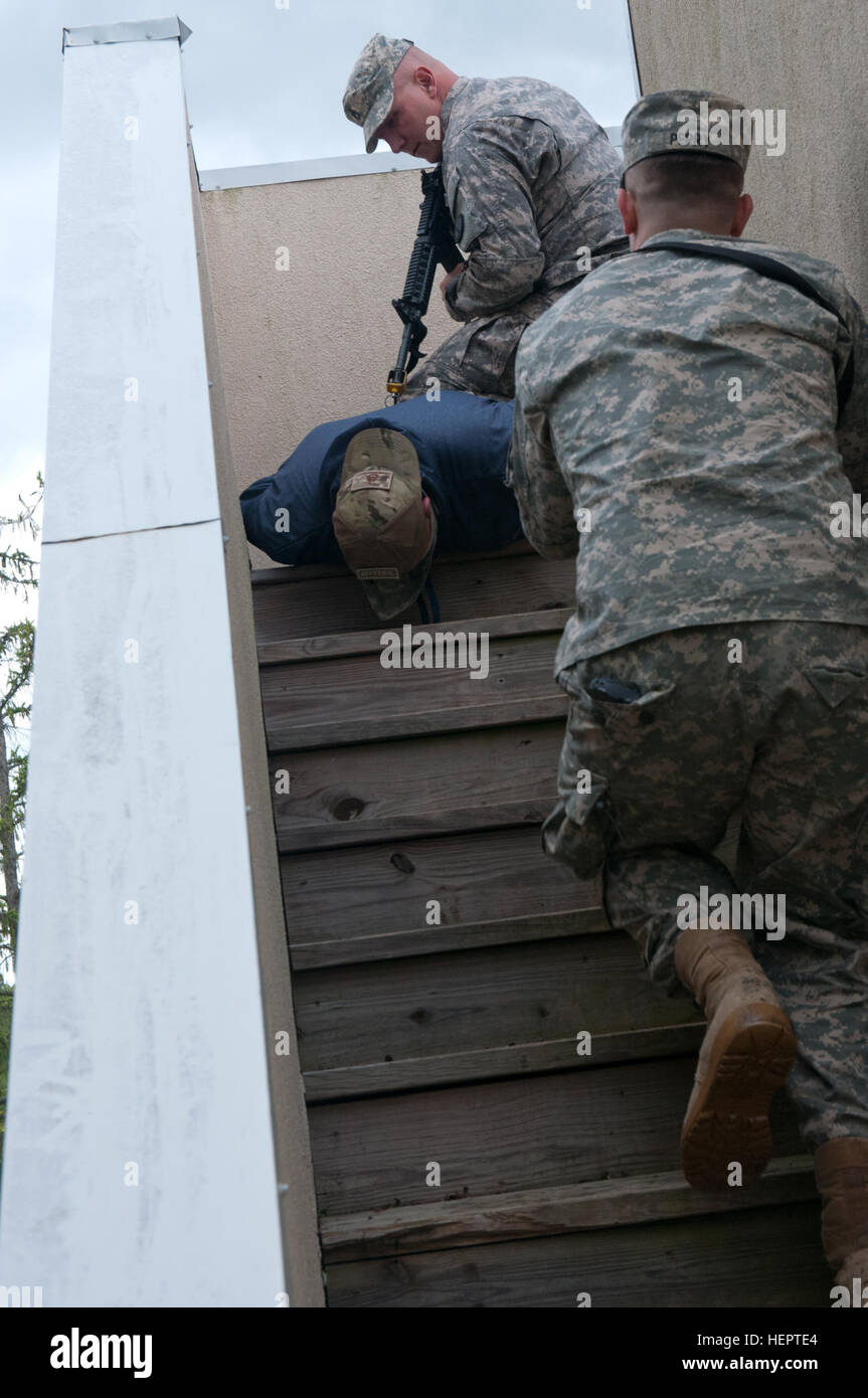 Staff Sgt. Jesse Franklin and Spc. Delano Perry simulate the detention ...